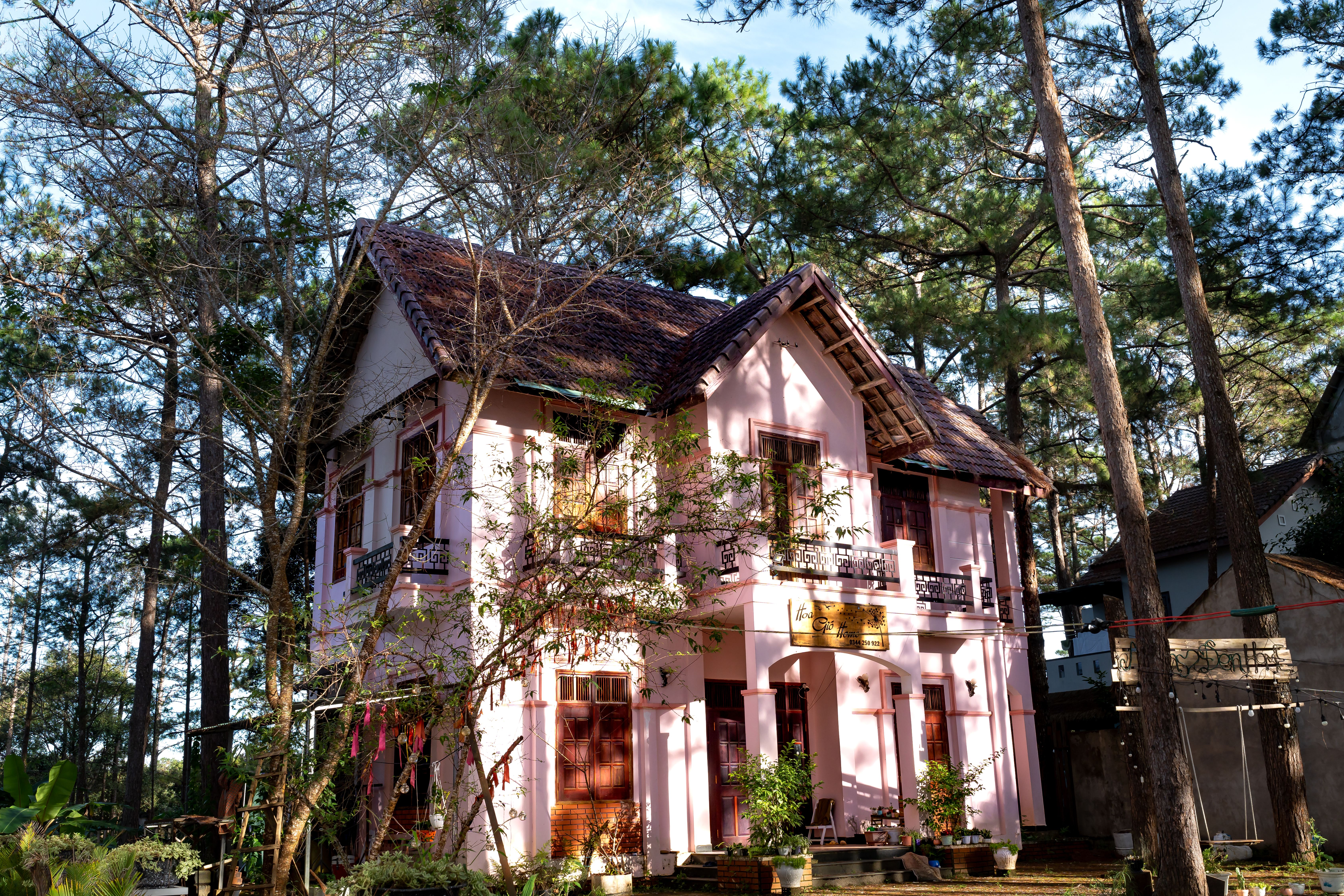 Pink Concrete House Surrounded by Trees · Free Stock Photo