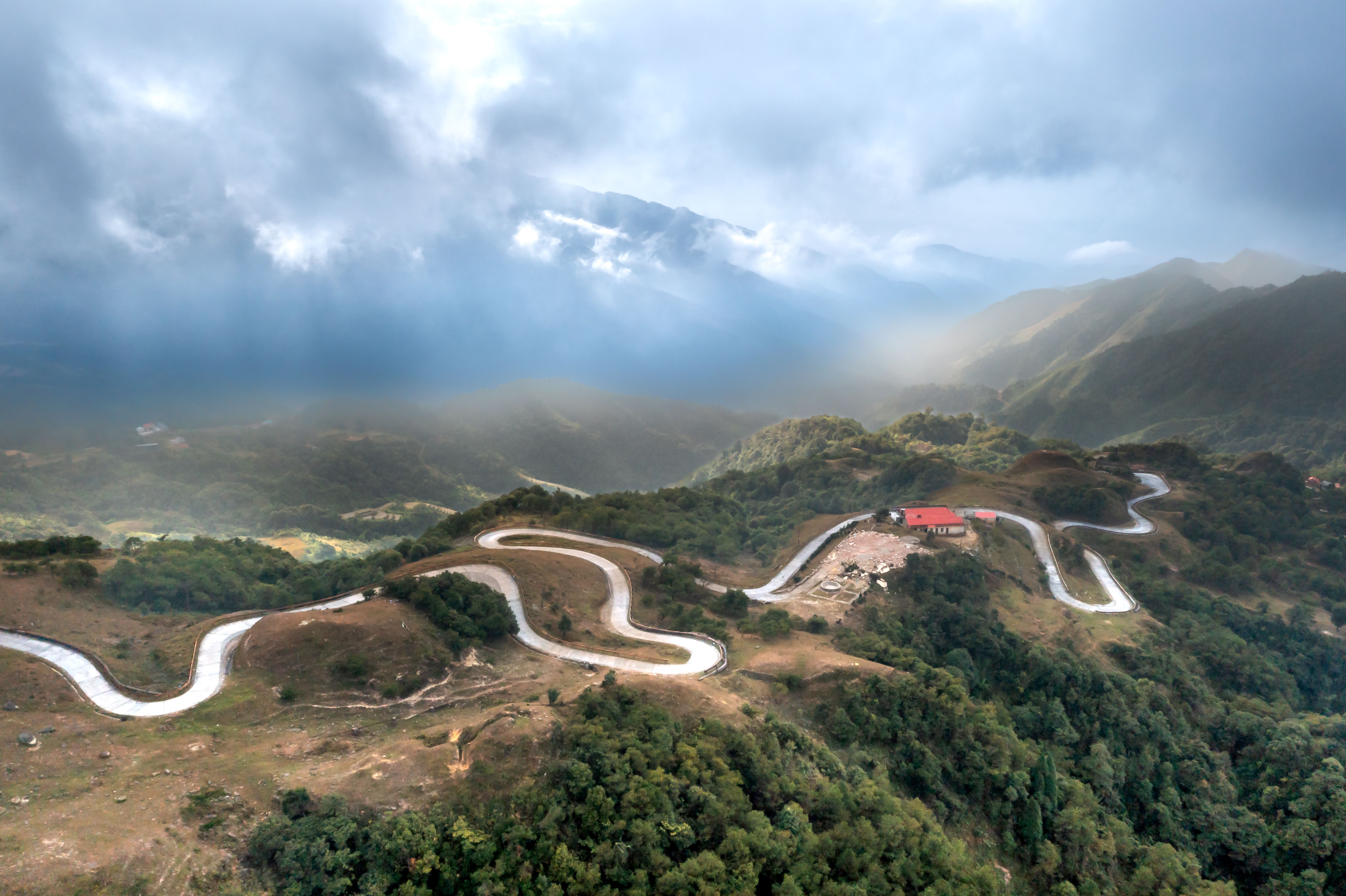 Aerial View of a Winding Road in the Country · Free Stock Photo