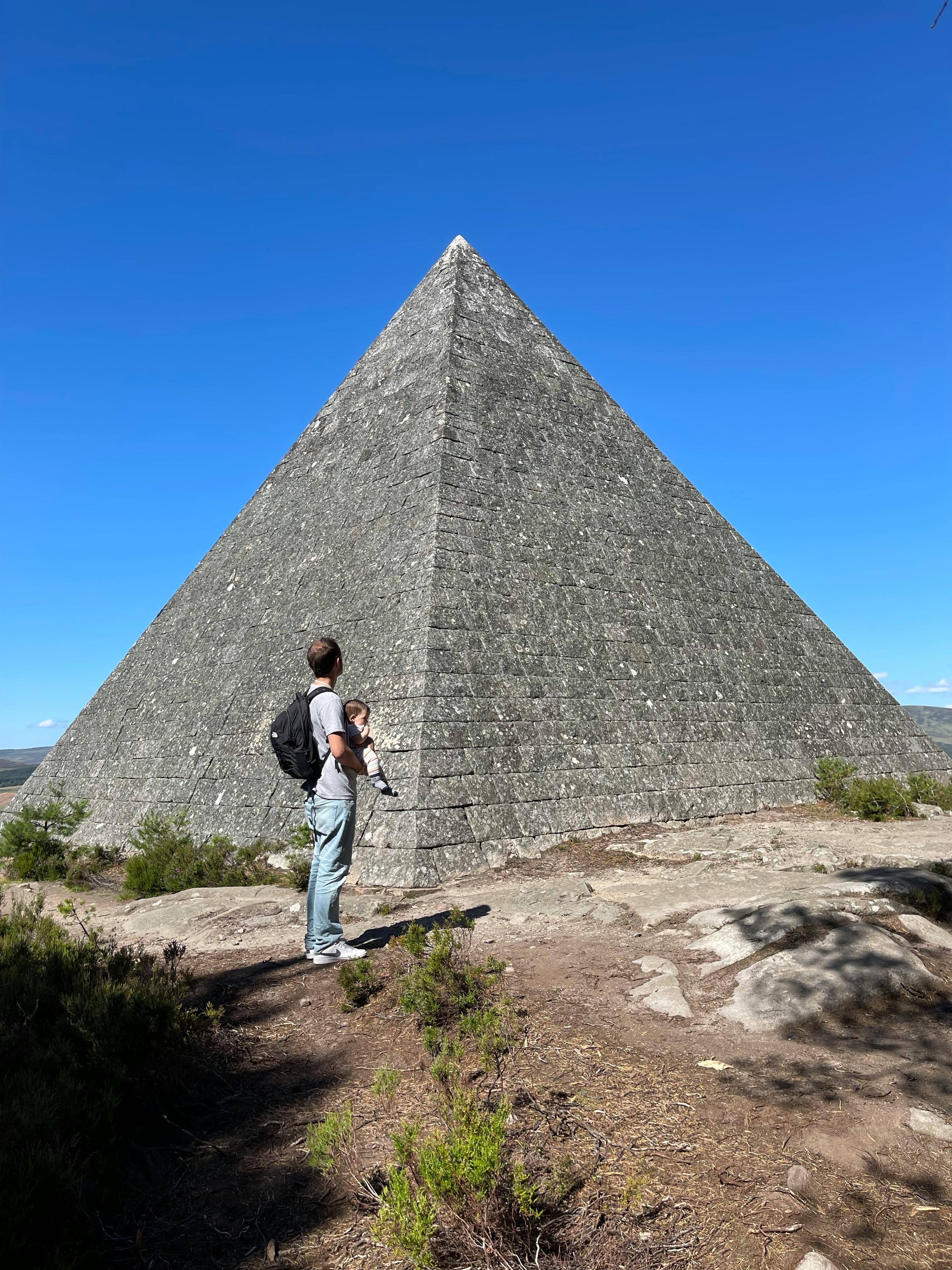 Man Standing by Prince Alberts Pyramid in Scotland · Free Stock Photo