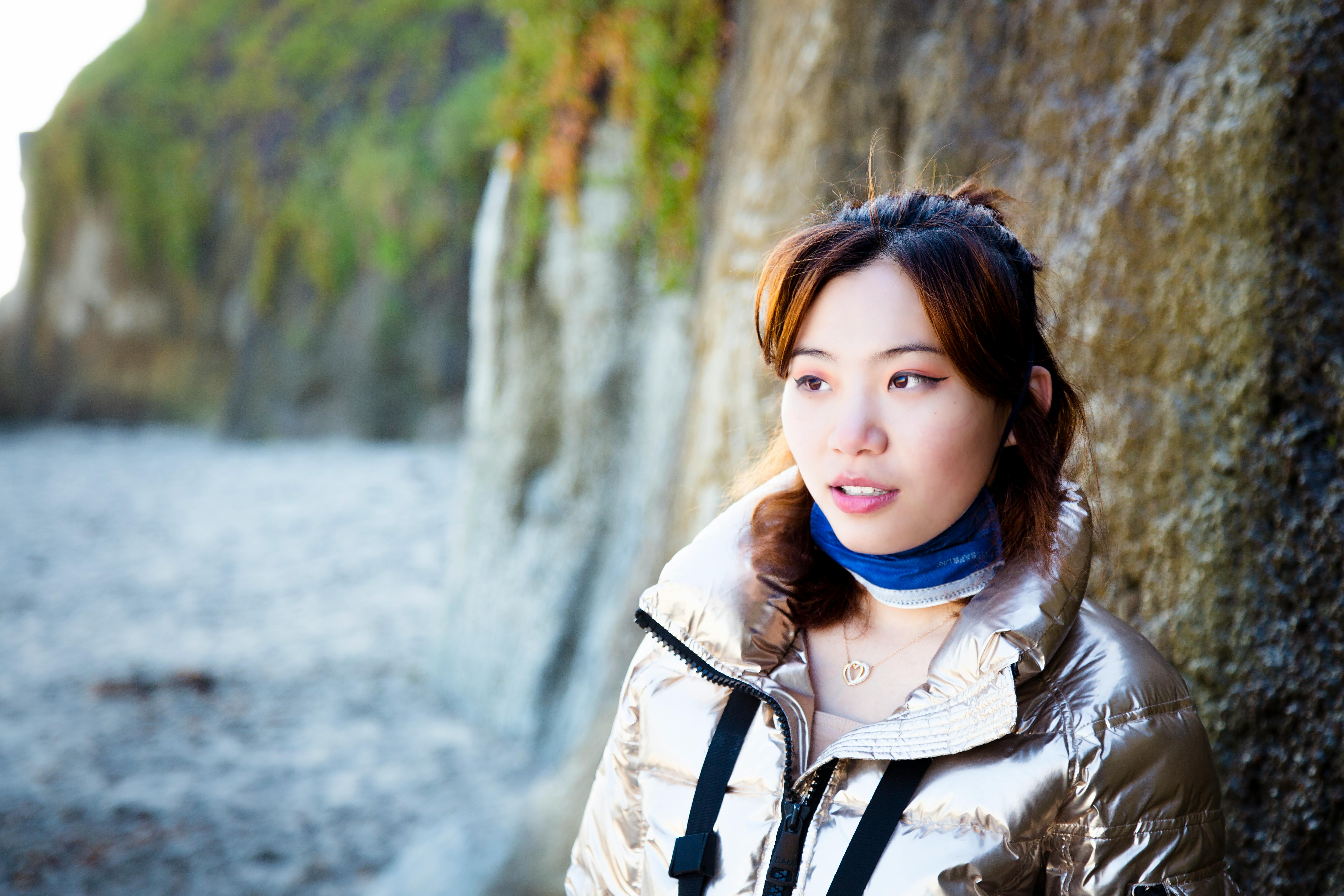 Portrait of Brunette Woman by the Shore · Free Stock Photo
