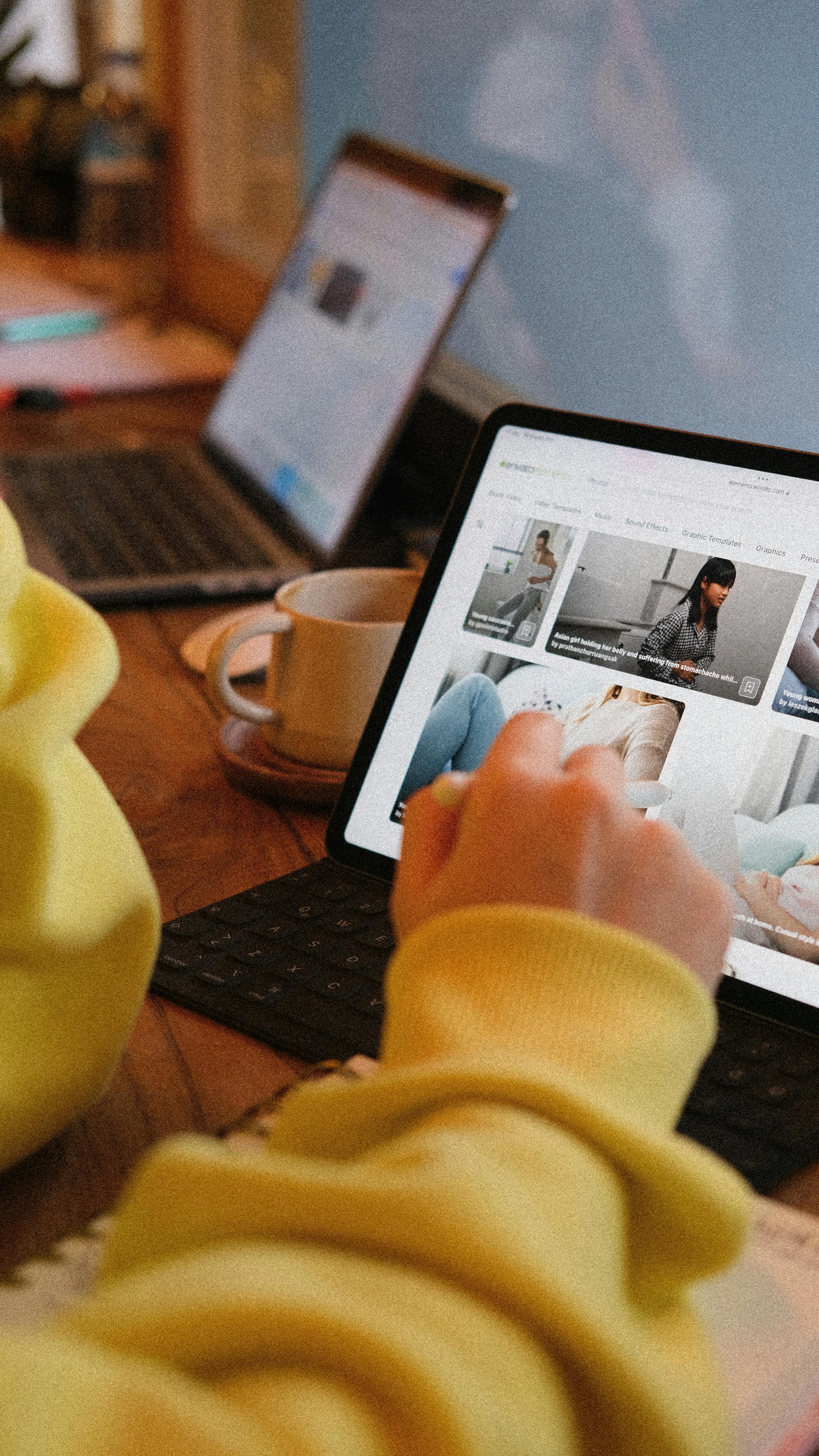 Hand over Laptops Screen · Free Stock Photo