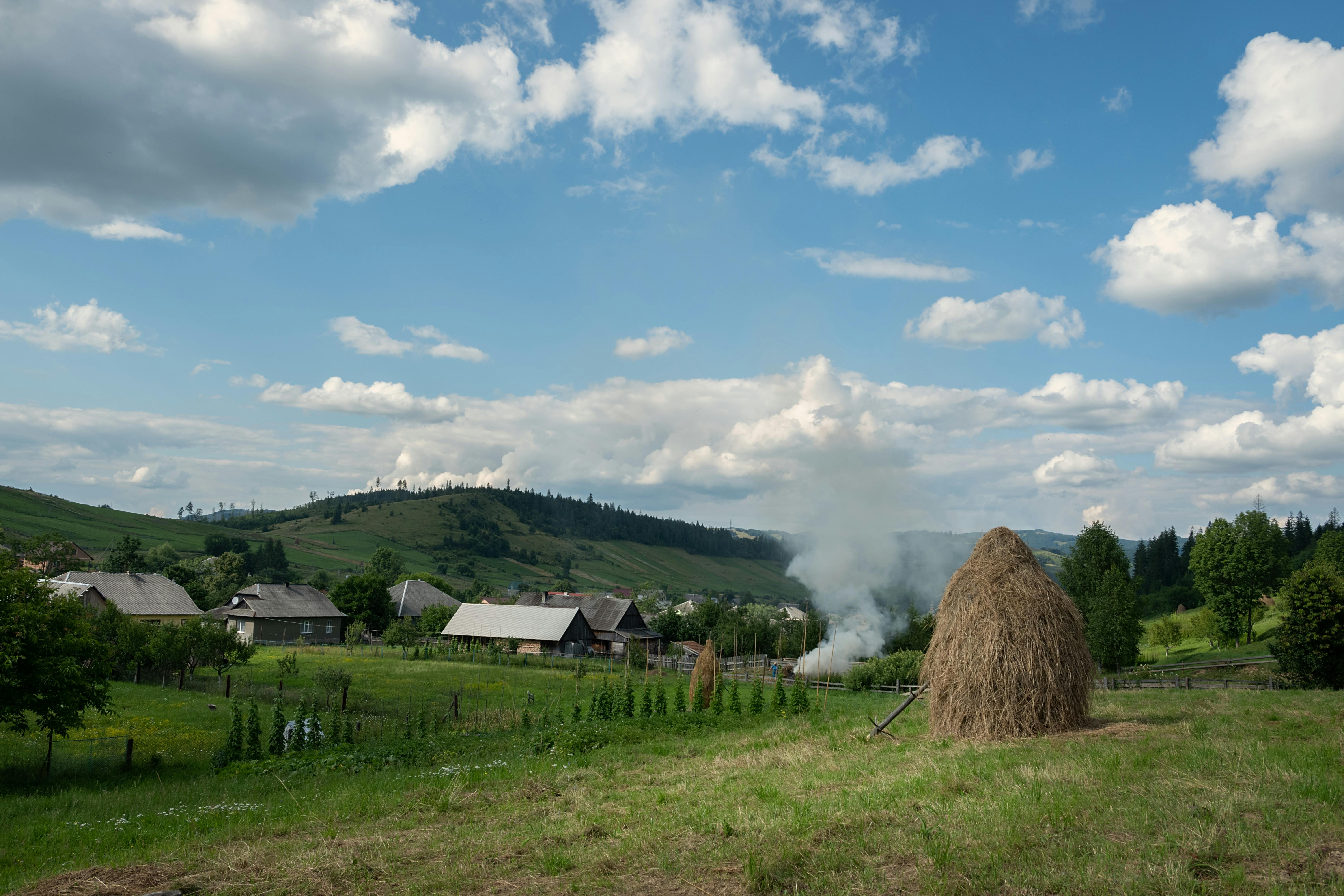 Hay Bale and Smoke in Village · Free Stock Photo