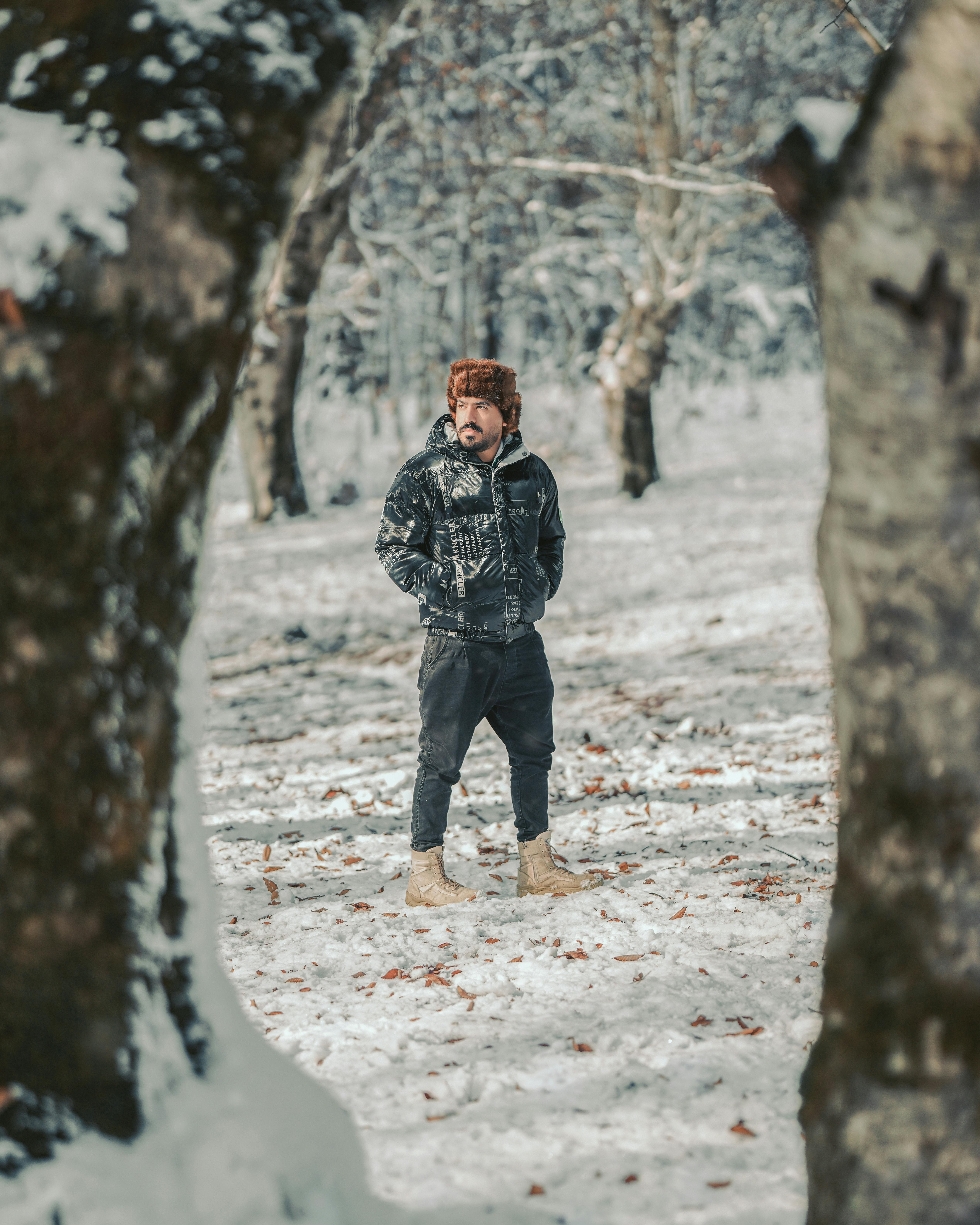 Man Standing Among Trees in Winter · Free Stock Photo