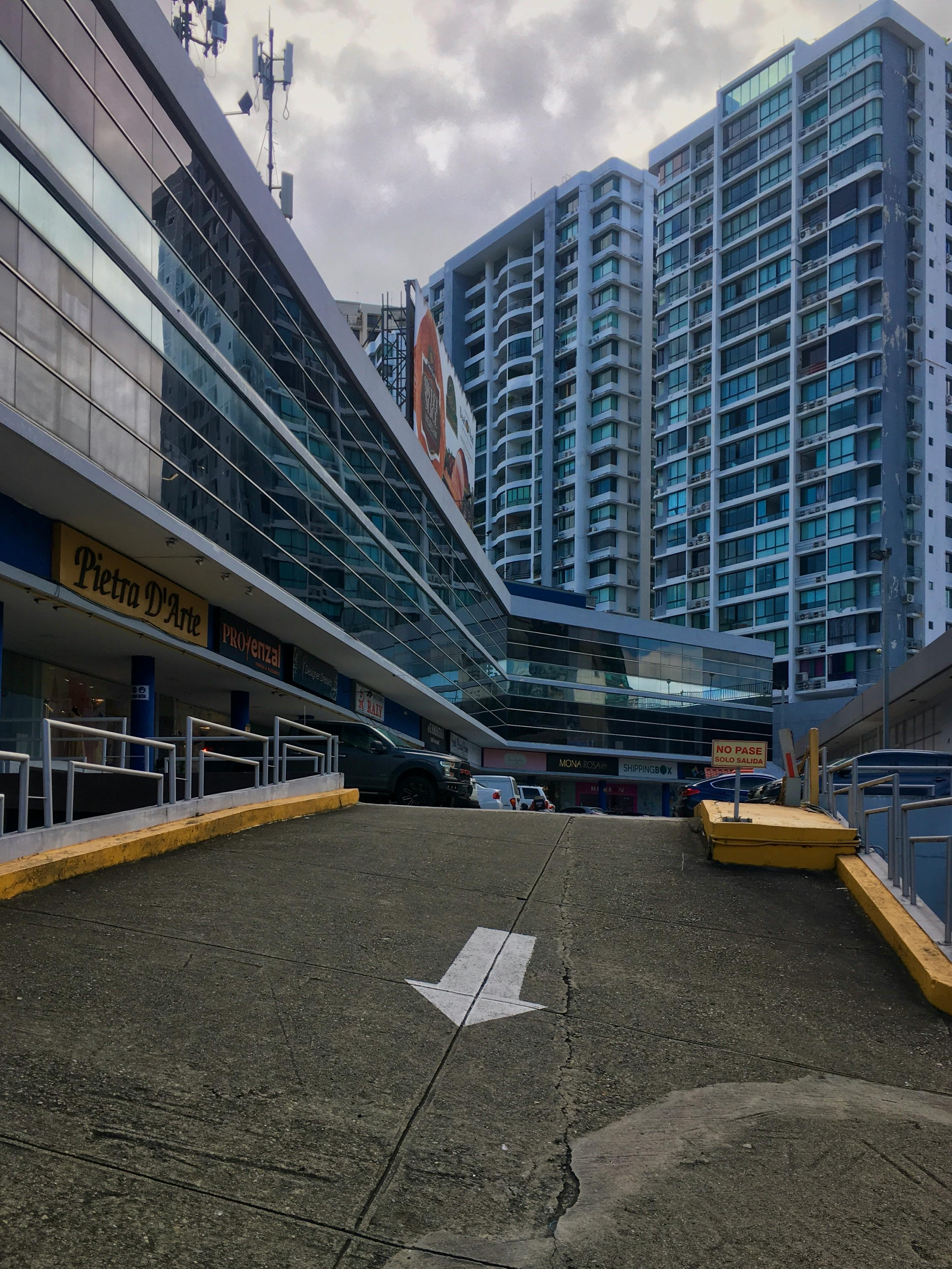 Parking Lot Ramp with Modern Apartments in the Background · Free Stock ...