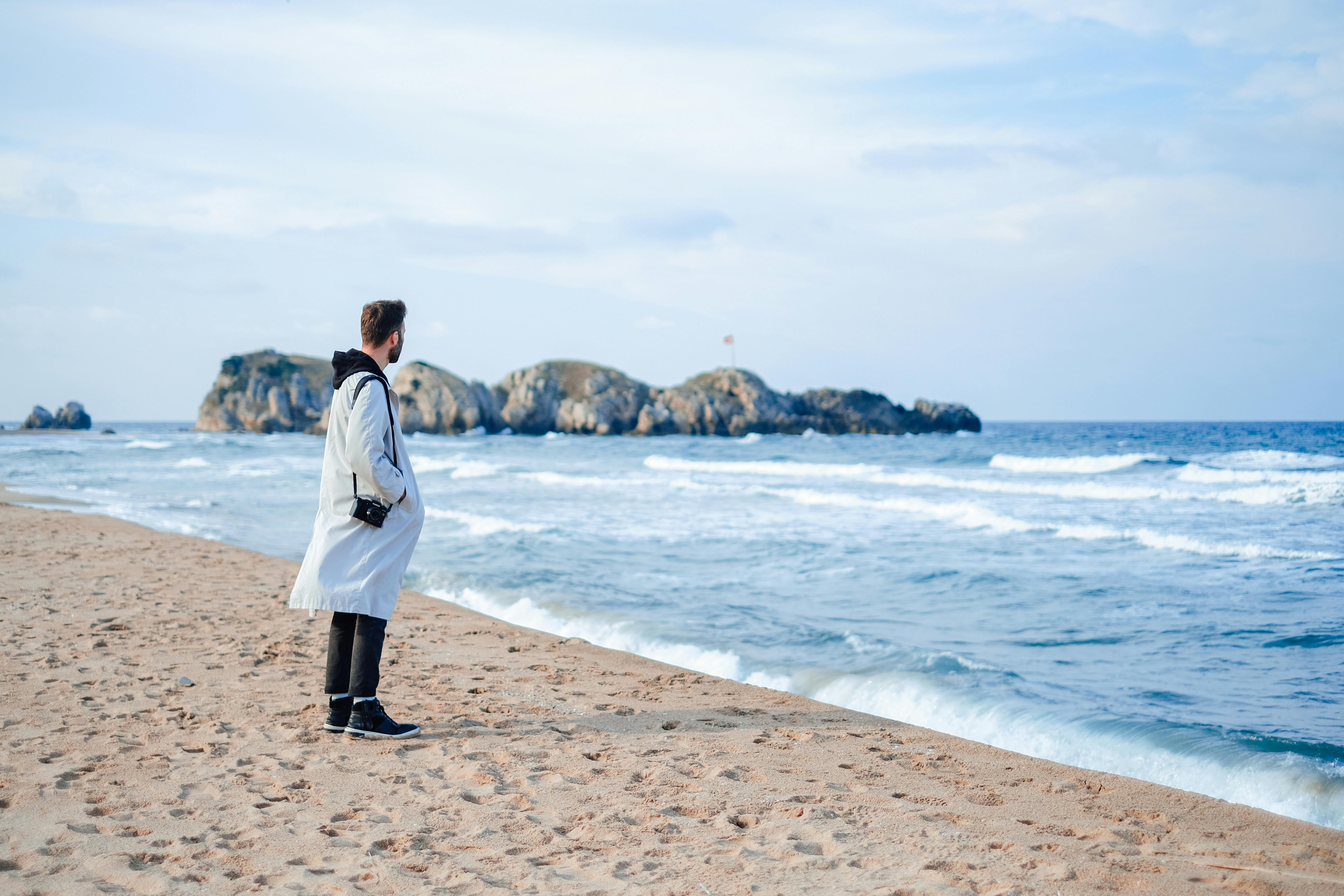 Man Standing on Beach · Free Stock Photo