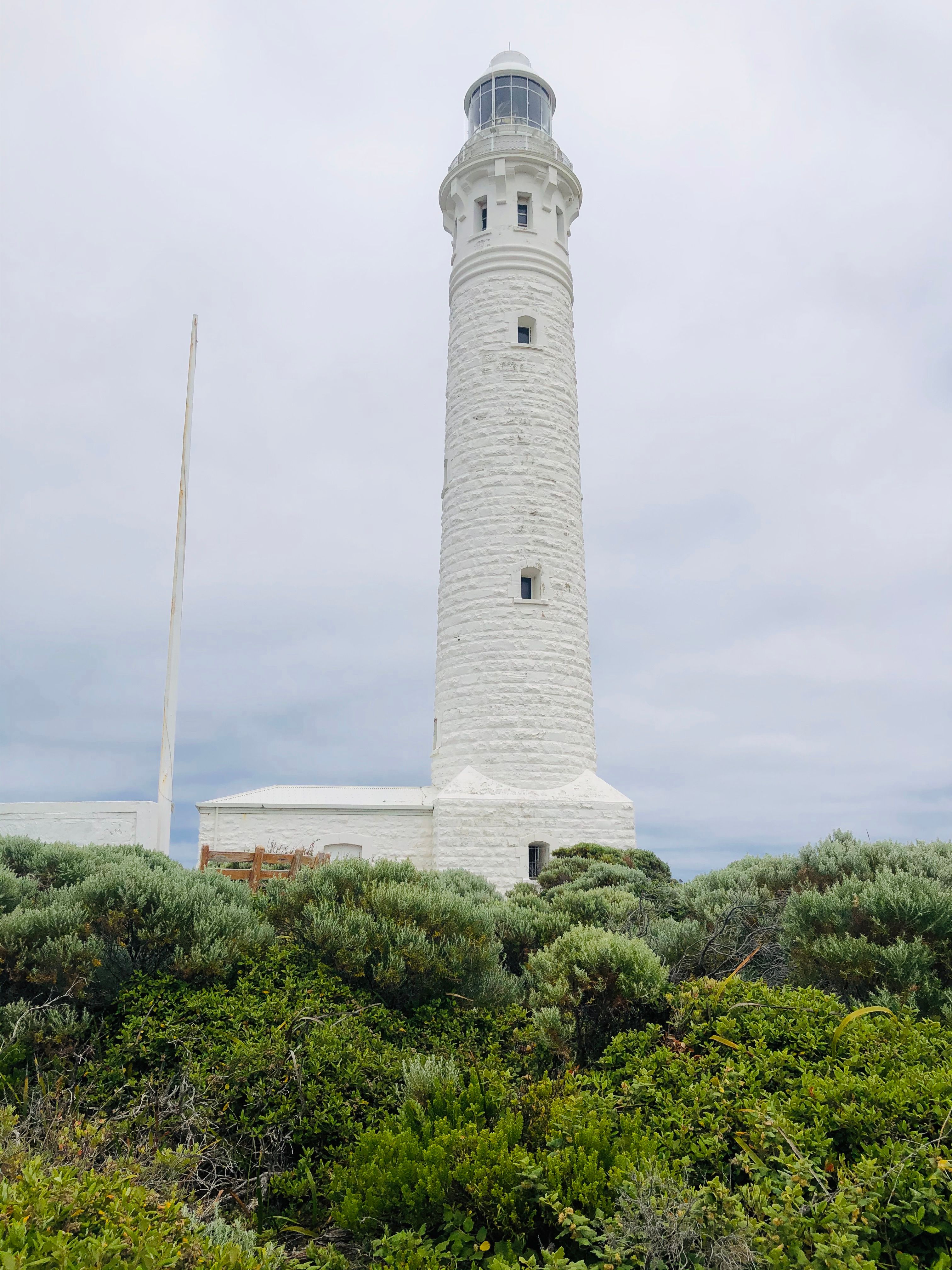 Viking Longboat and Lighthouse behind · Free Stock Photo