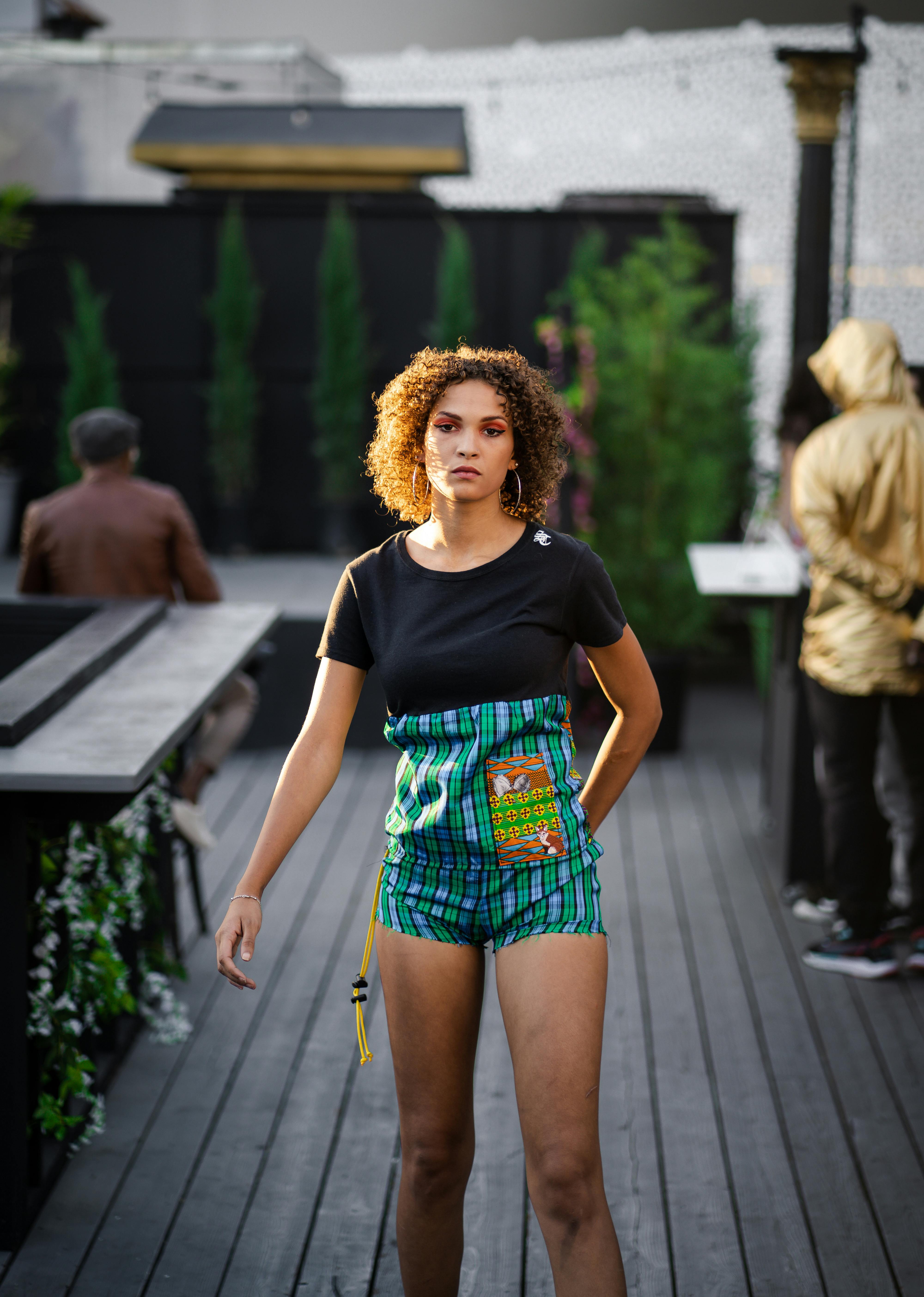 Woman with Curly Hair Posing · Free Stock Photo