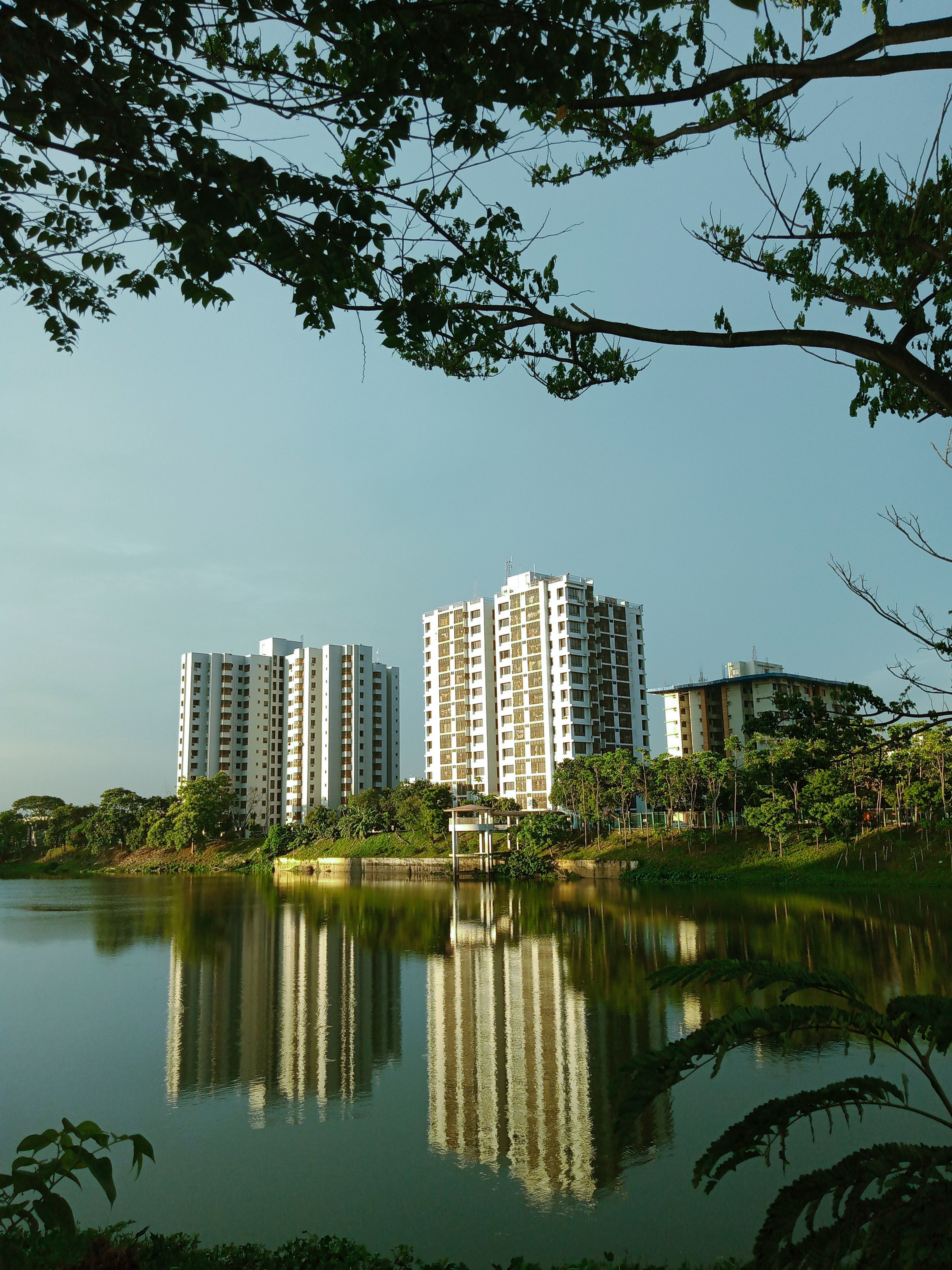 High Rise White Buildings Near a Body of Water · Free Stock Photo