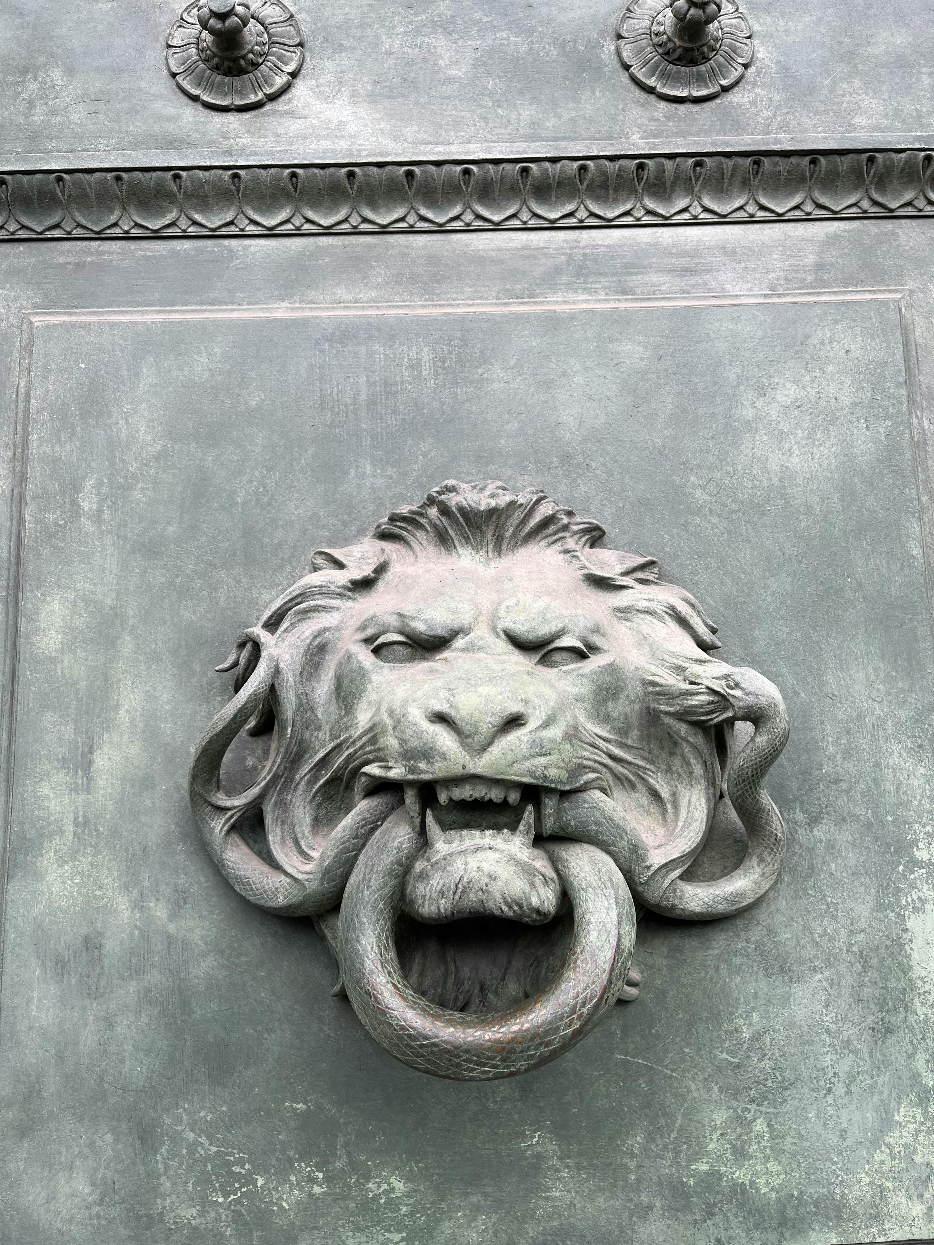 Lion Stone Decor on Building Wall · Free Stock Photo