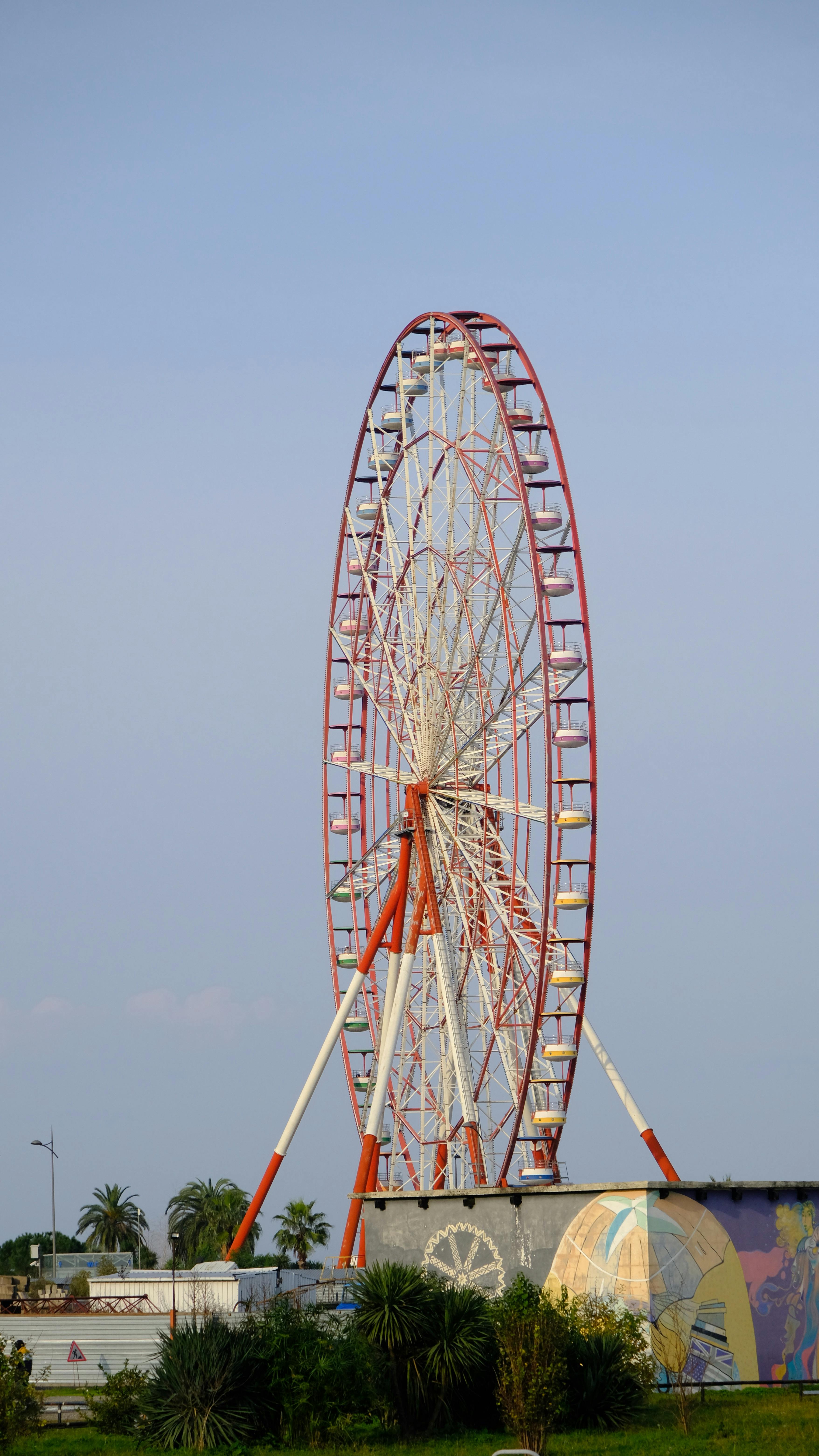 Close-up of a Red Ferris Wheel against Clear Blue Sky · Free Stock Photo