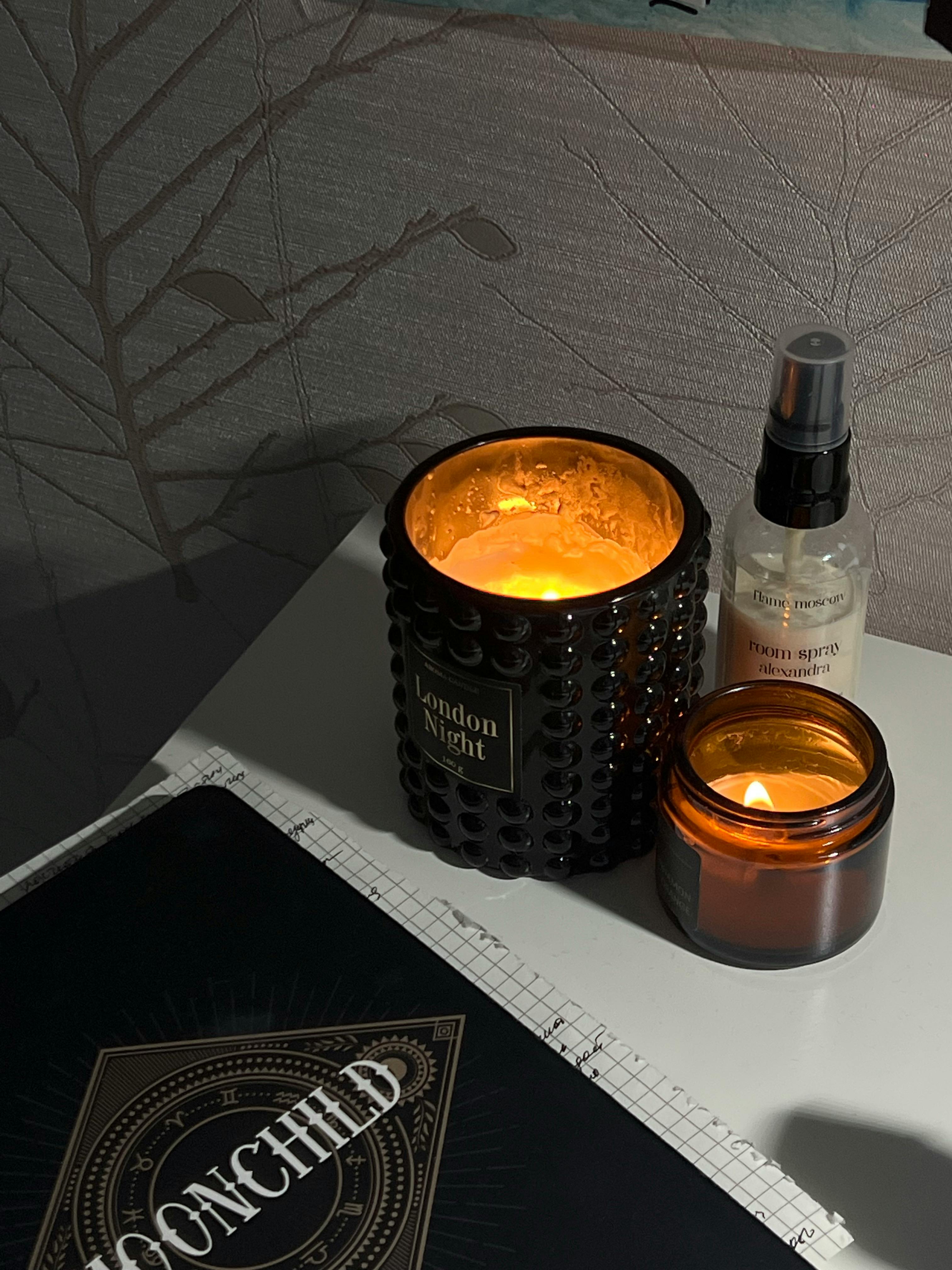 Photo of a Lit Candle Near an Incense Stick · Free Stock Photo