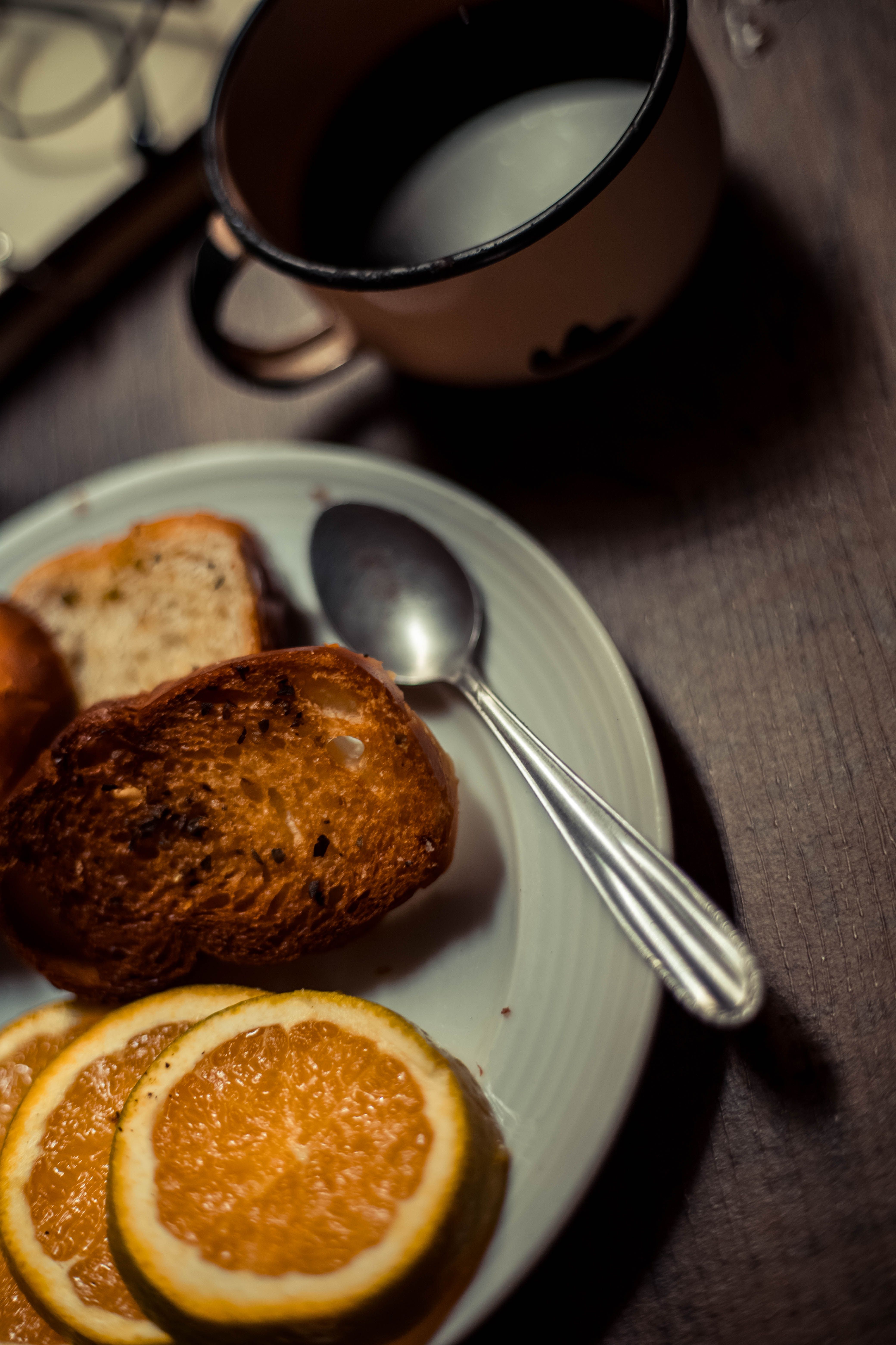 A Moka Pot Beside a Plate with Bread · Free Stock Photo