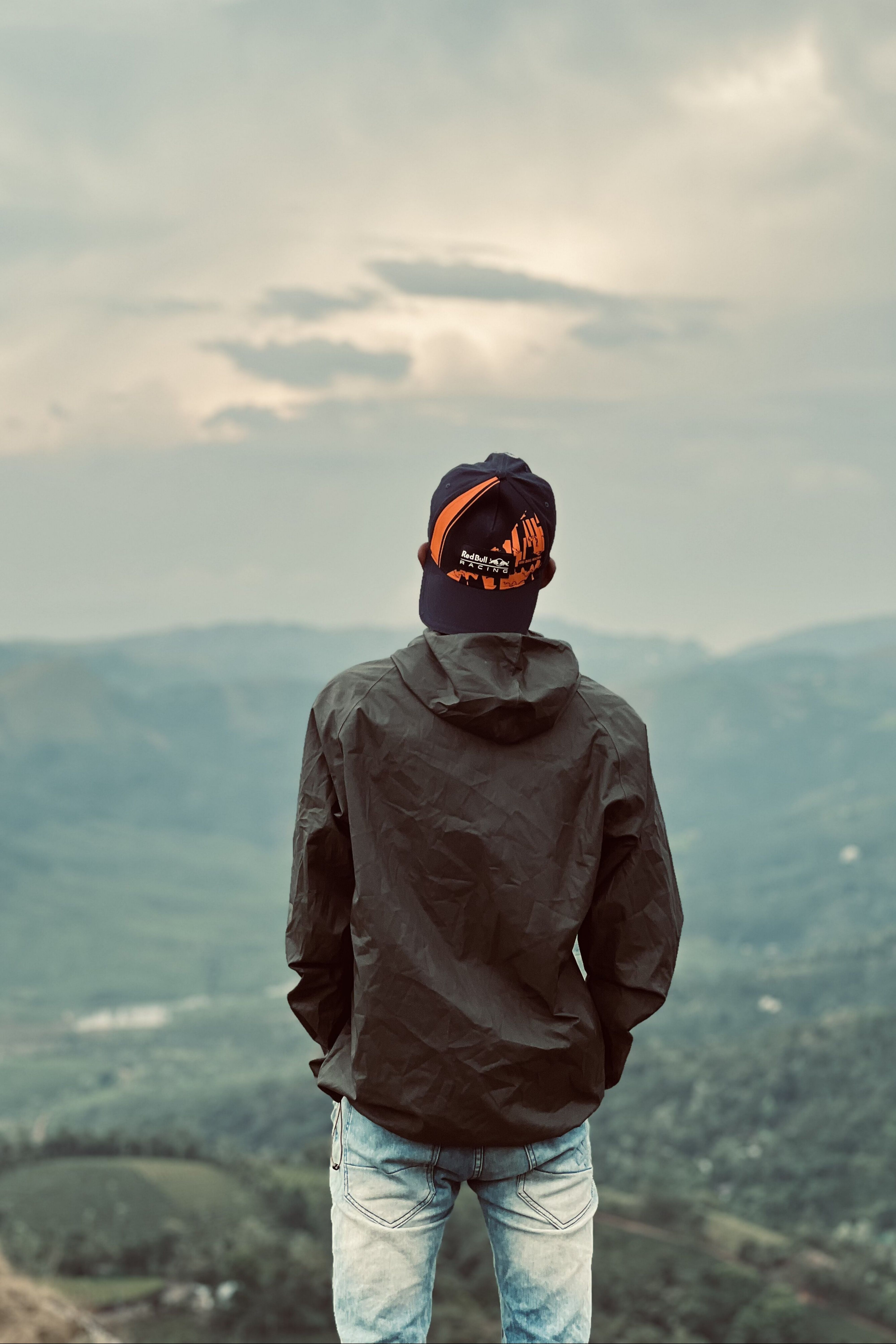 Back View of Man in Cap and Jacket · Free Stock Photo