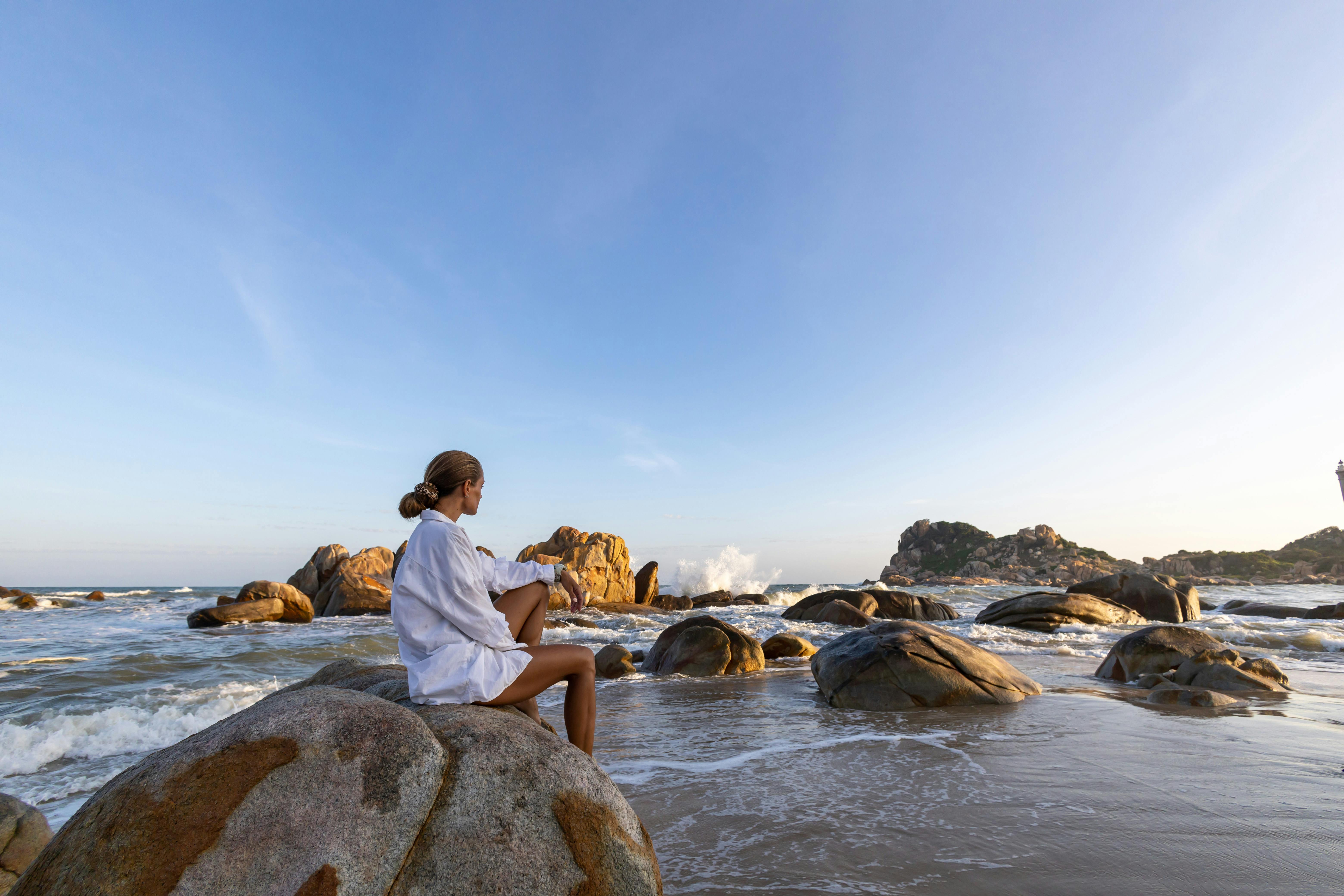 Woman on Rock Formation · Free Stock Photo