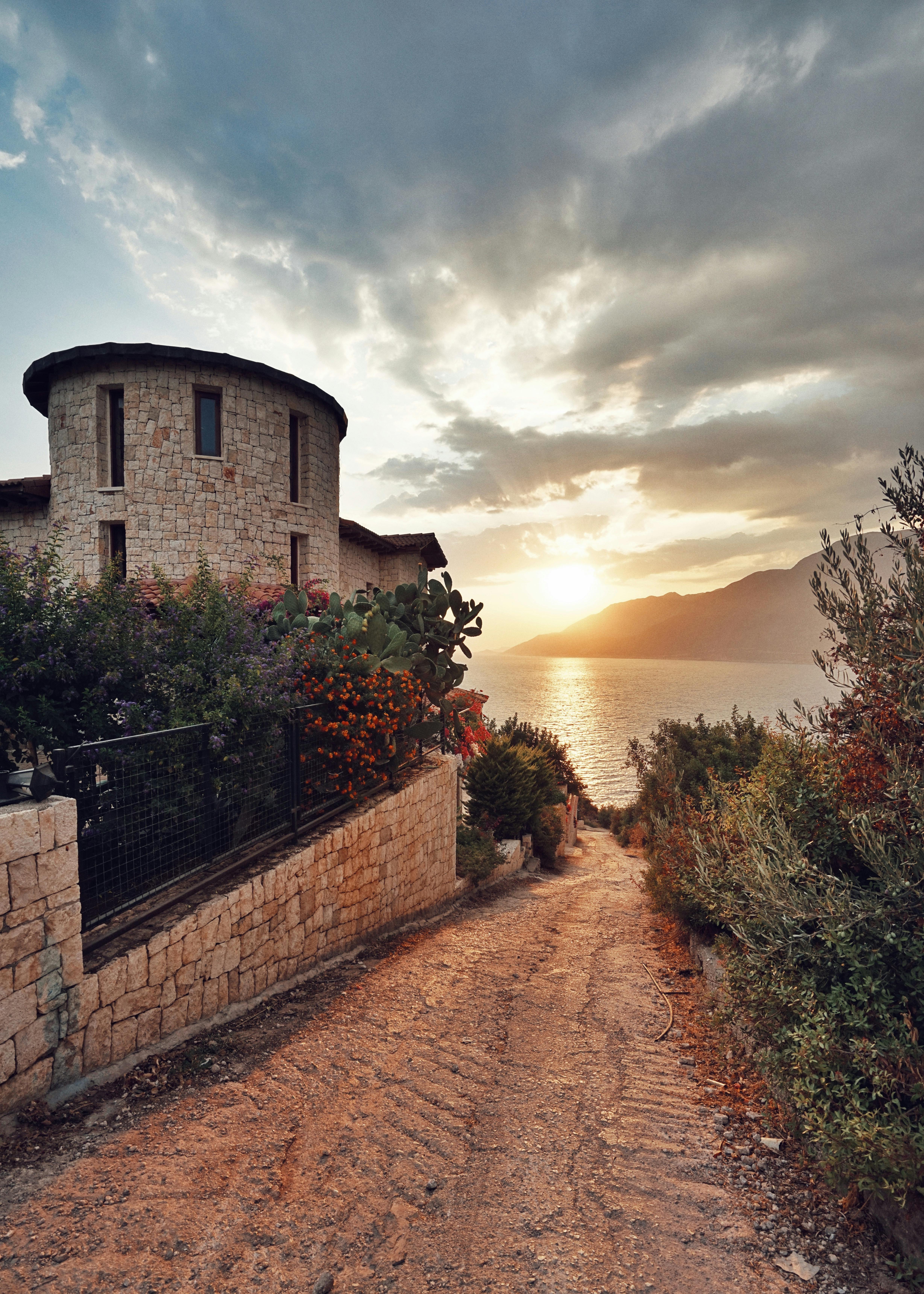 A Path and a Building on a Seashore · Free Stock Photo