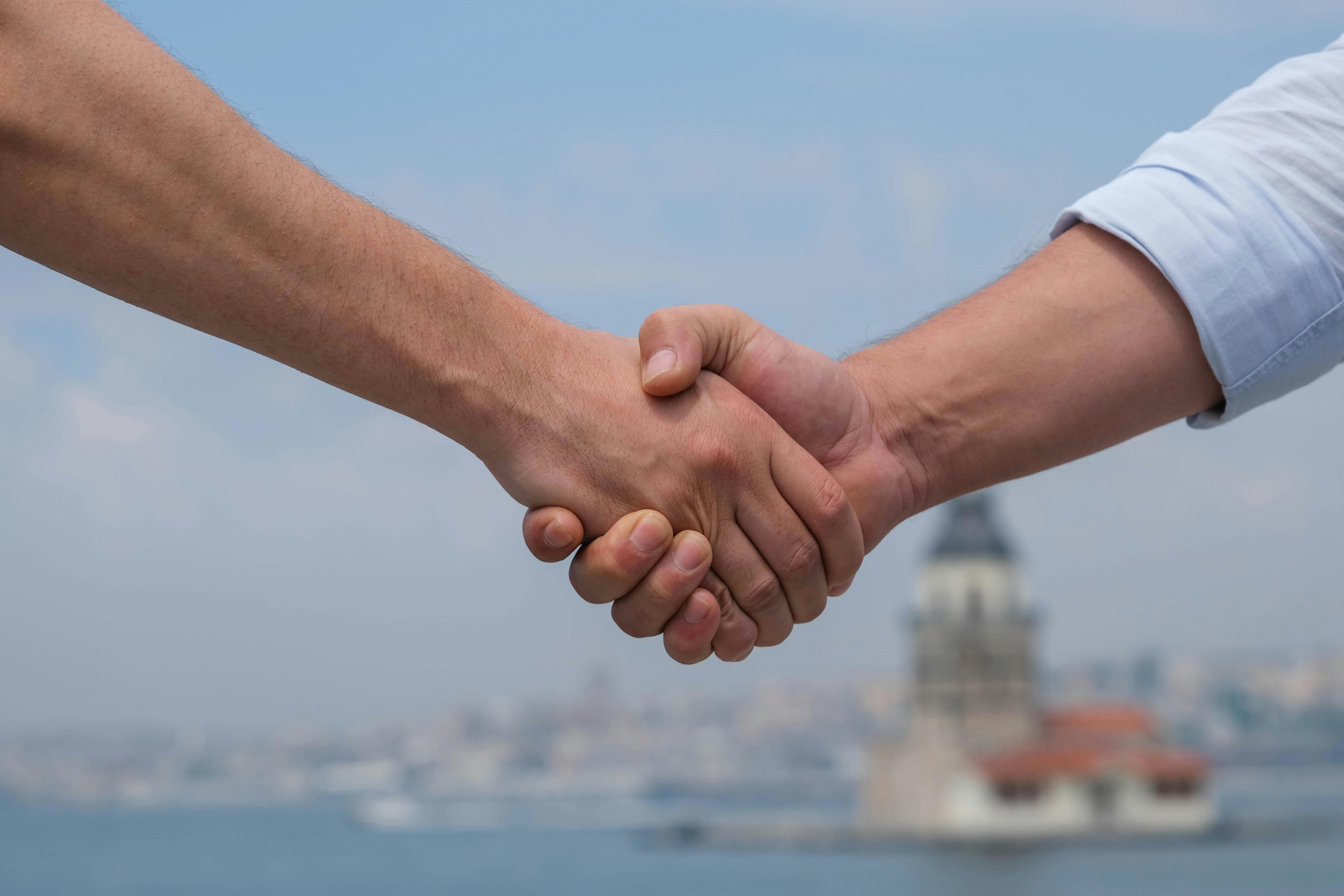 Monochrome Photography of People Shaking Hands · Free Stock Photo