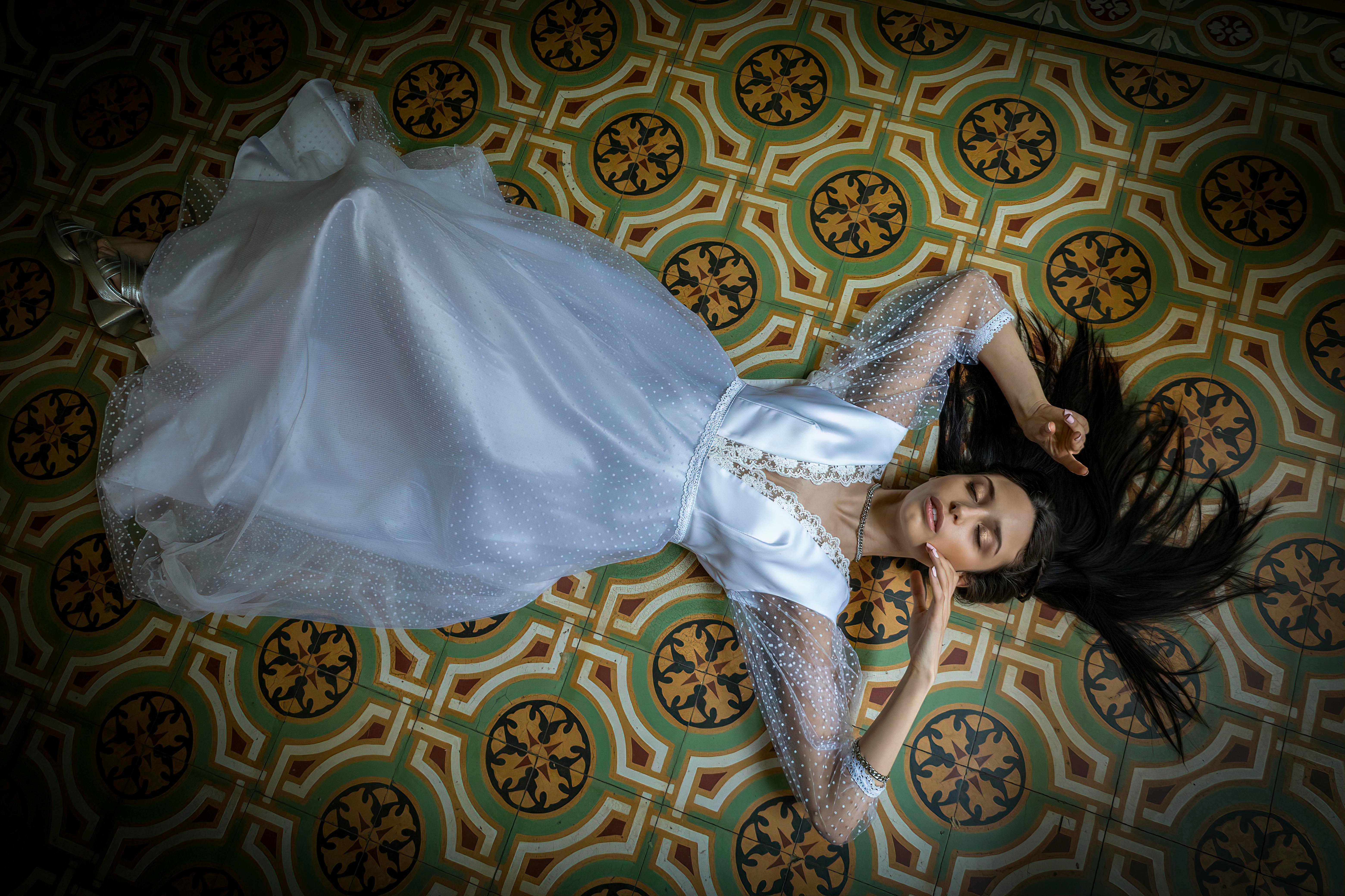 Woman in Dress Lying Down on Ground · Free Stock Photo