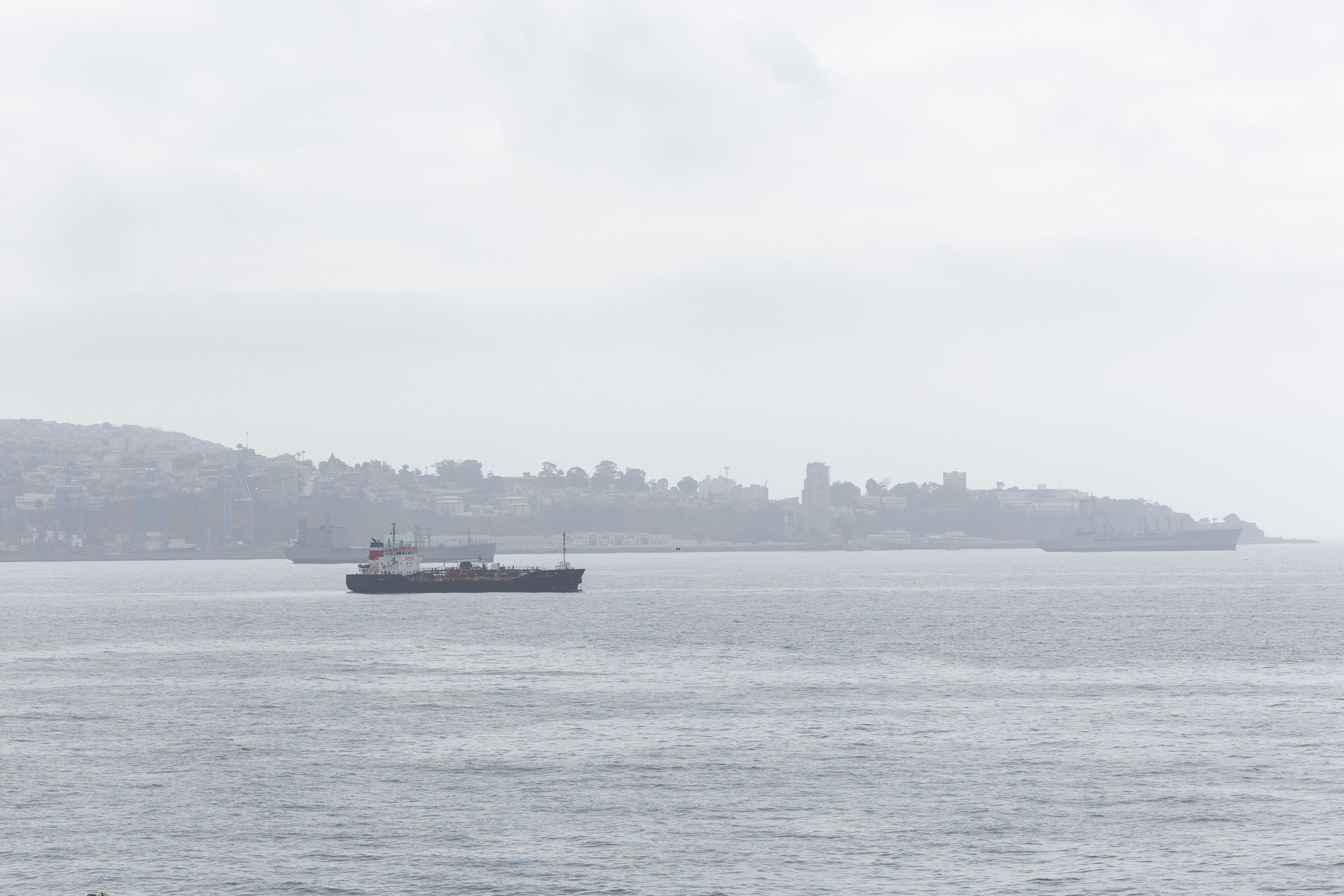 Blue Boat on Sea under Gloomy Sky · Free Stock Photo