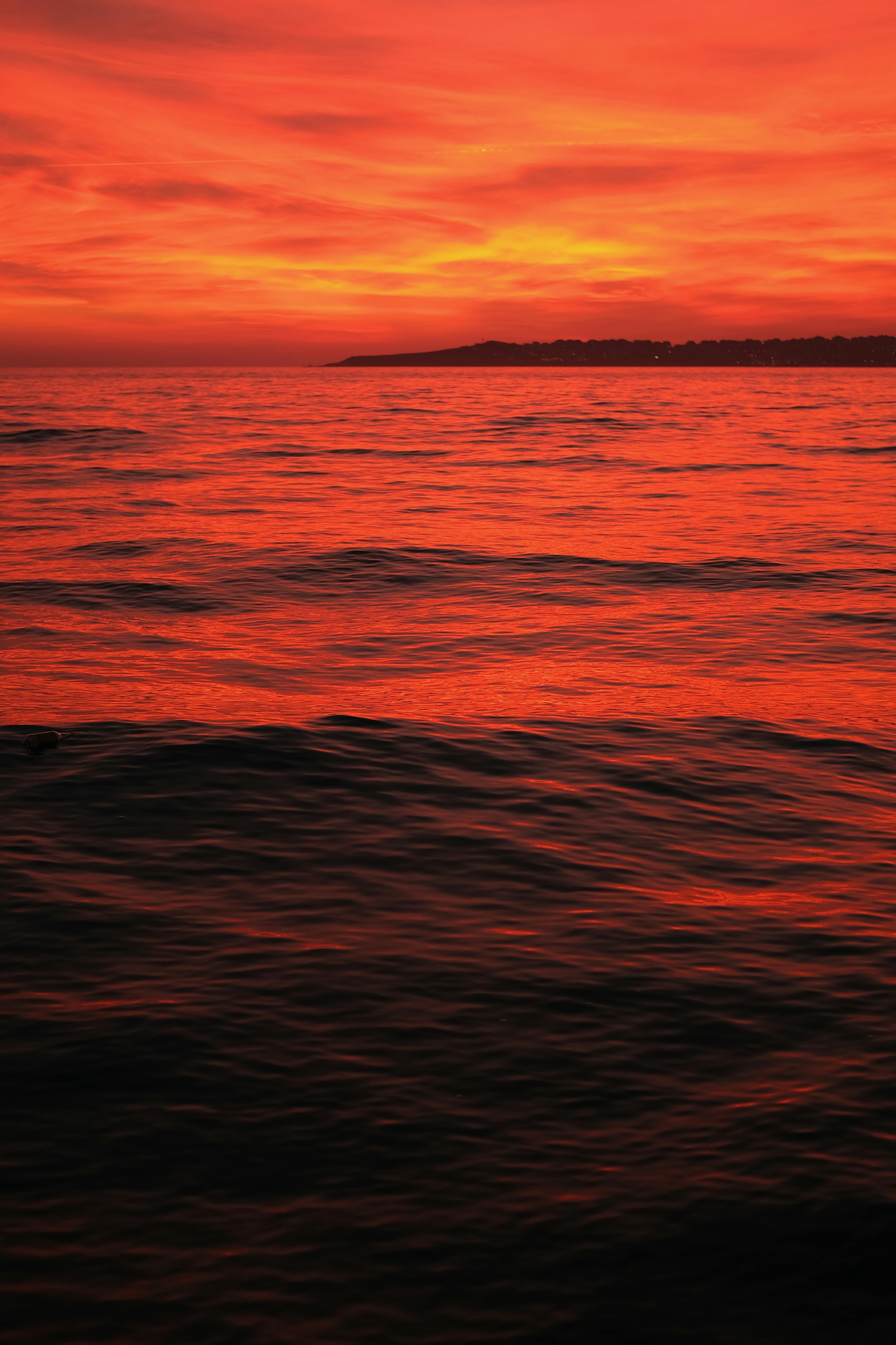 A Sunset Over Body of Water · Free Stock Photo