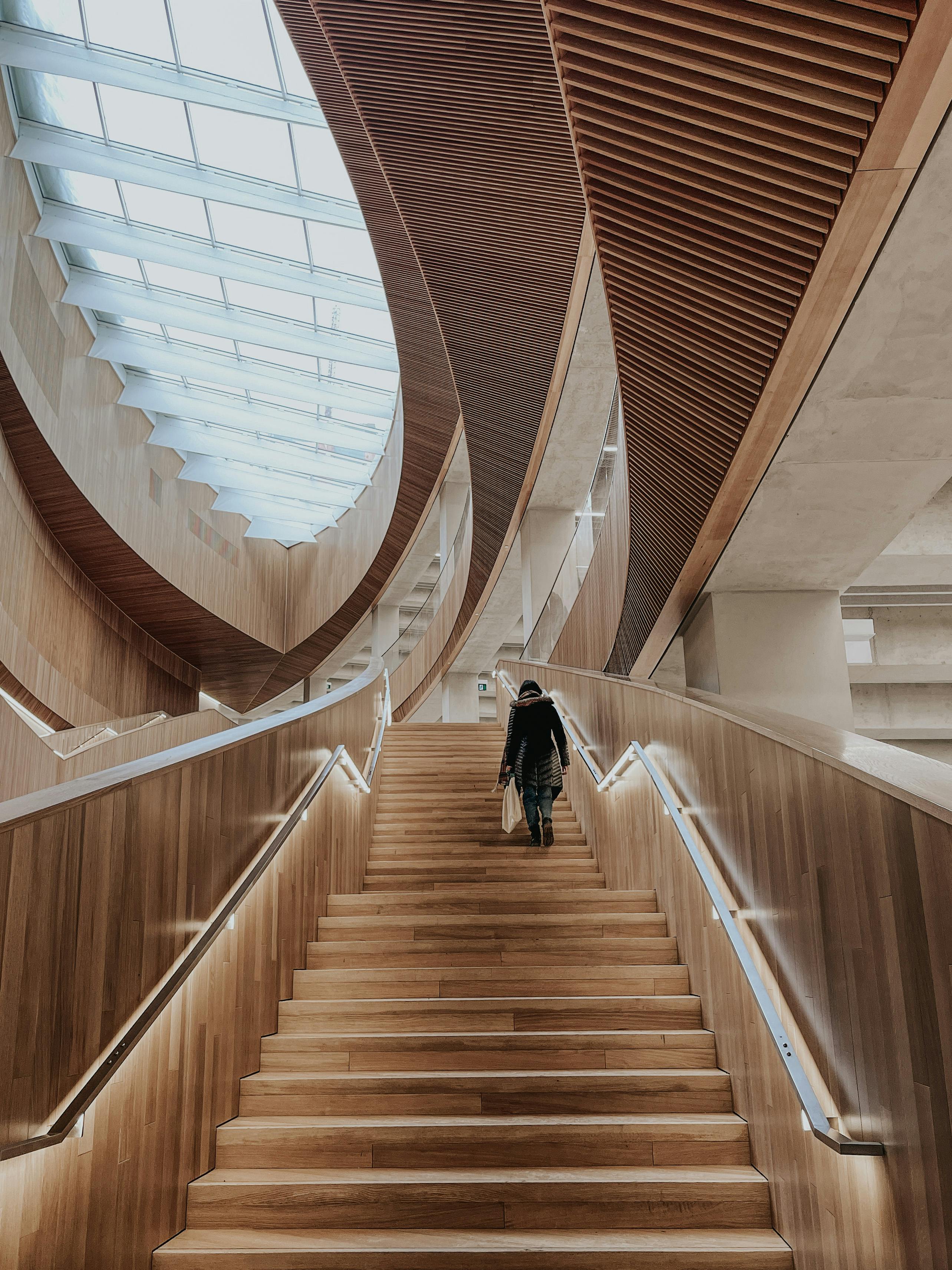 Back View of Woman Walking on the Stairs in the Central Library in ...