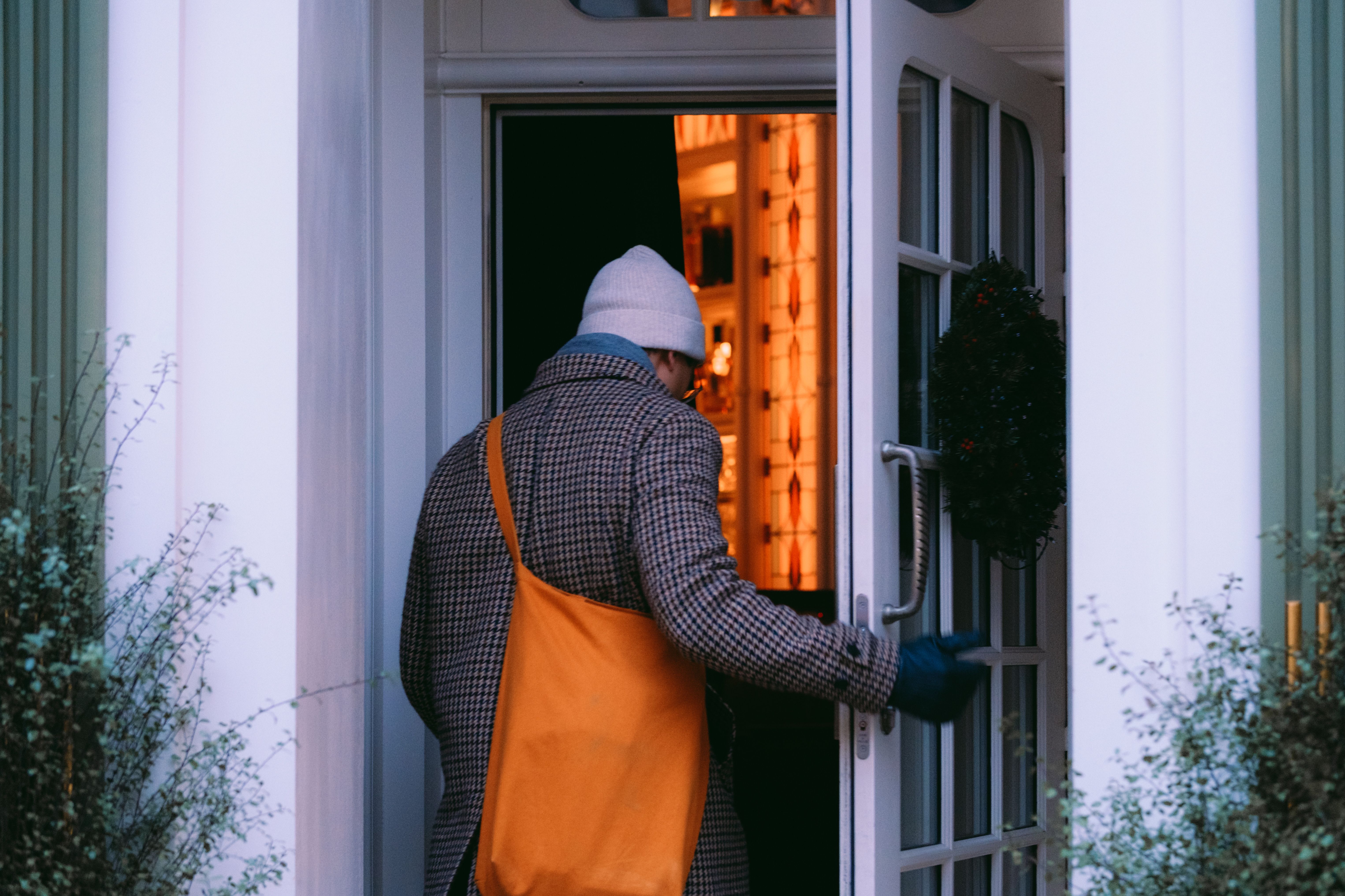 Photo of a Woman Opening a Door · Free Stock Photo
