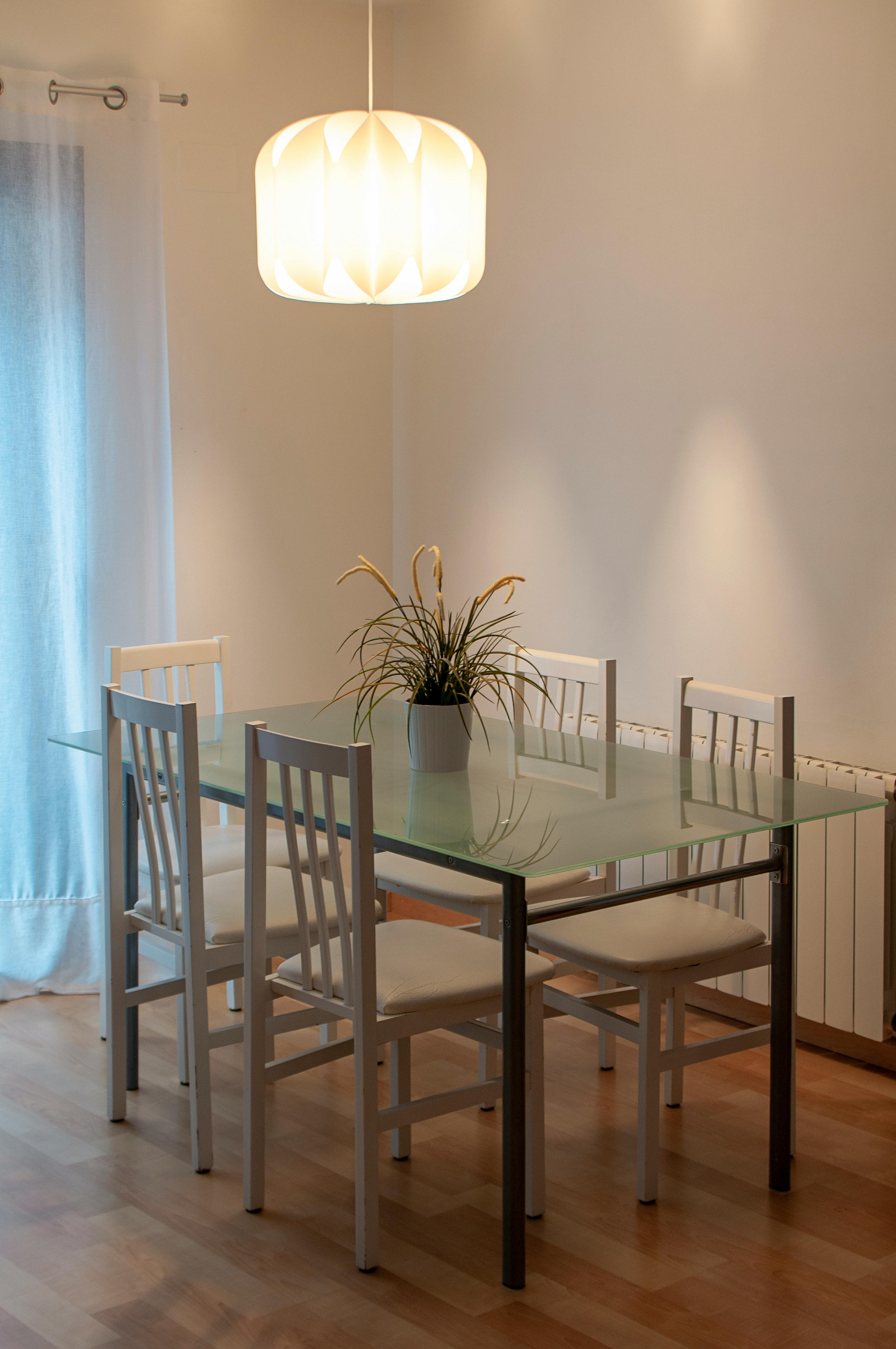 Chairs and a Glass Table Under a Lamp · Free Stock Photo