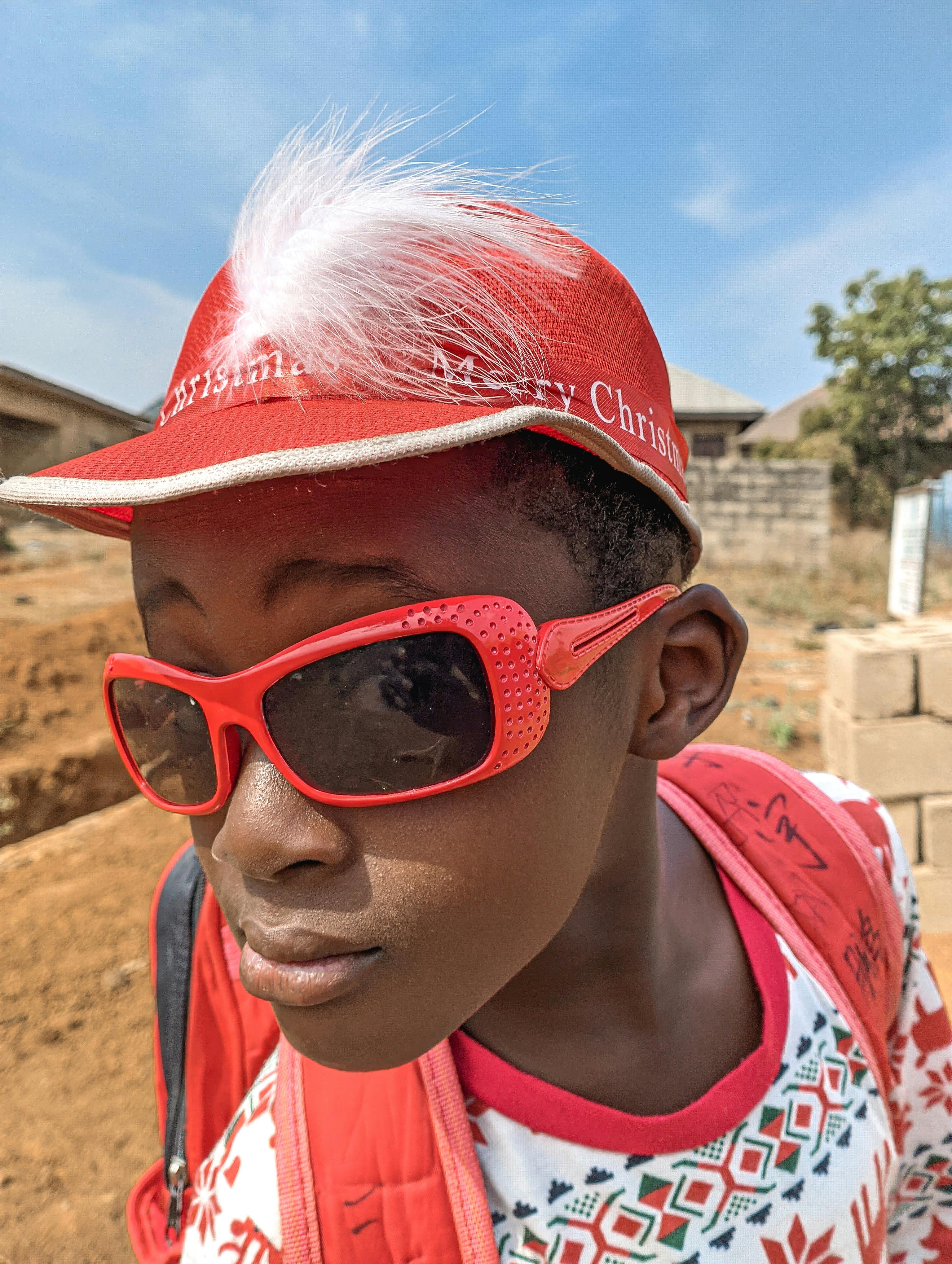 A Boy Wearing Red Cap · Free Stock Photo