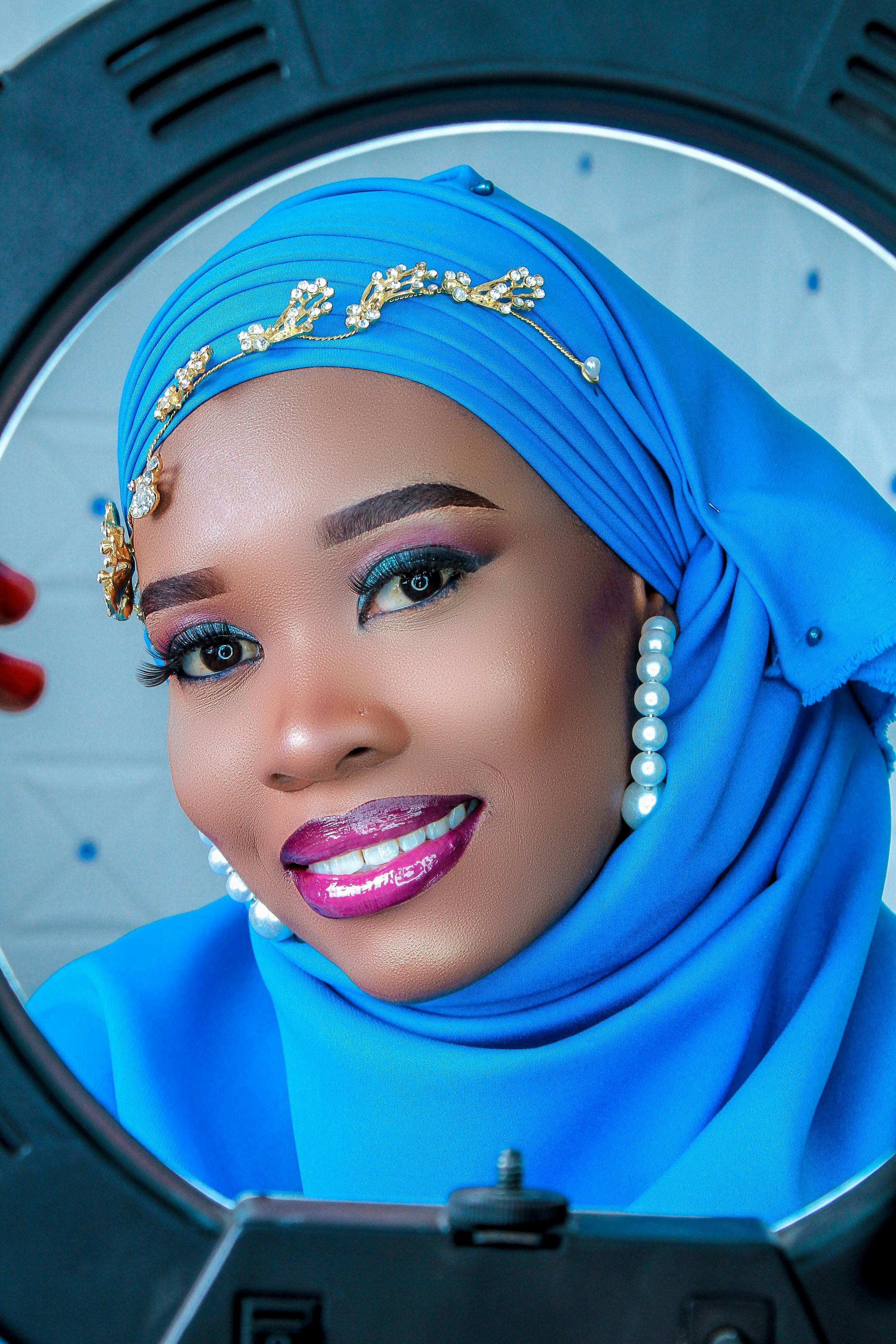 Young Man Holding a Ring Light around His Neck · Free Stock Photo