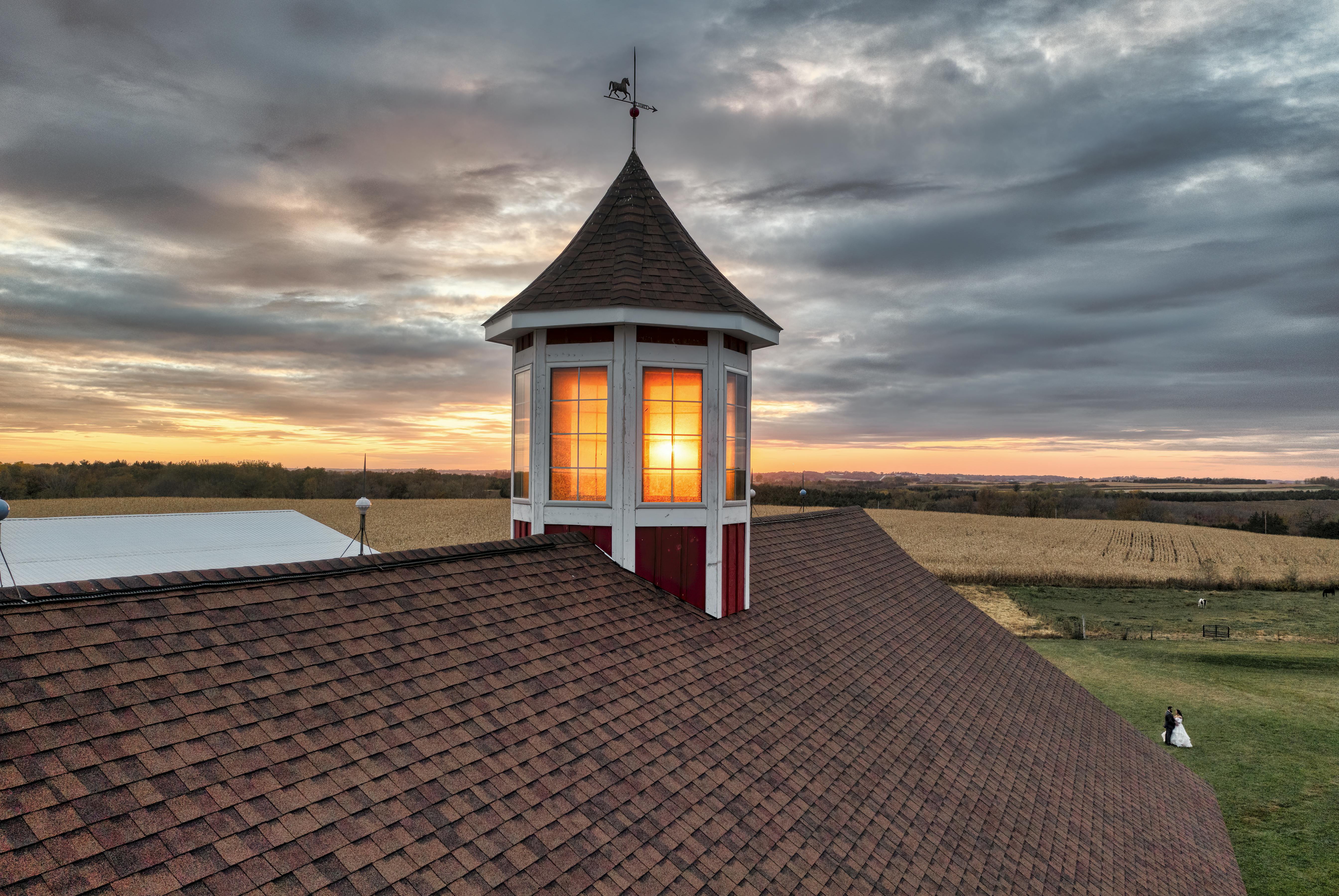 Sunset Seen Through Window of Tower on Roof · Free Stock Photo