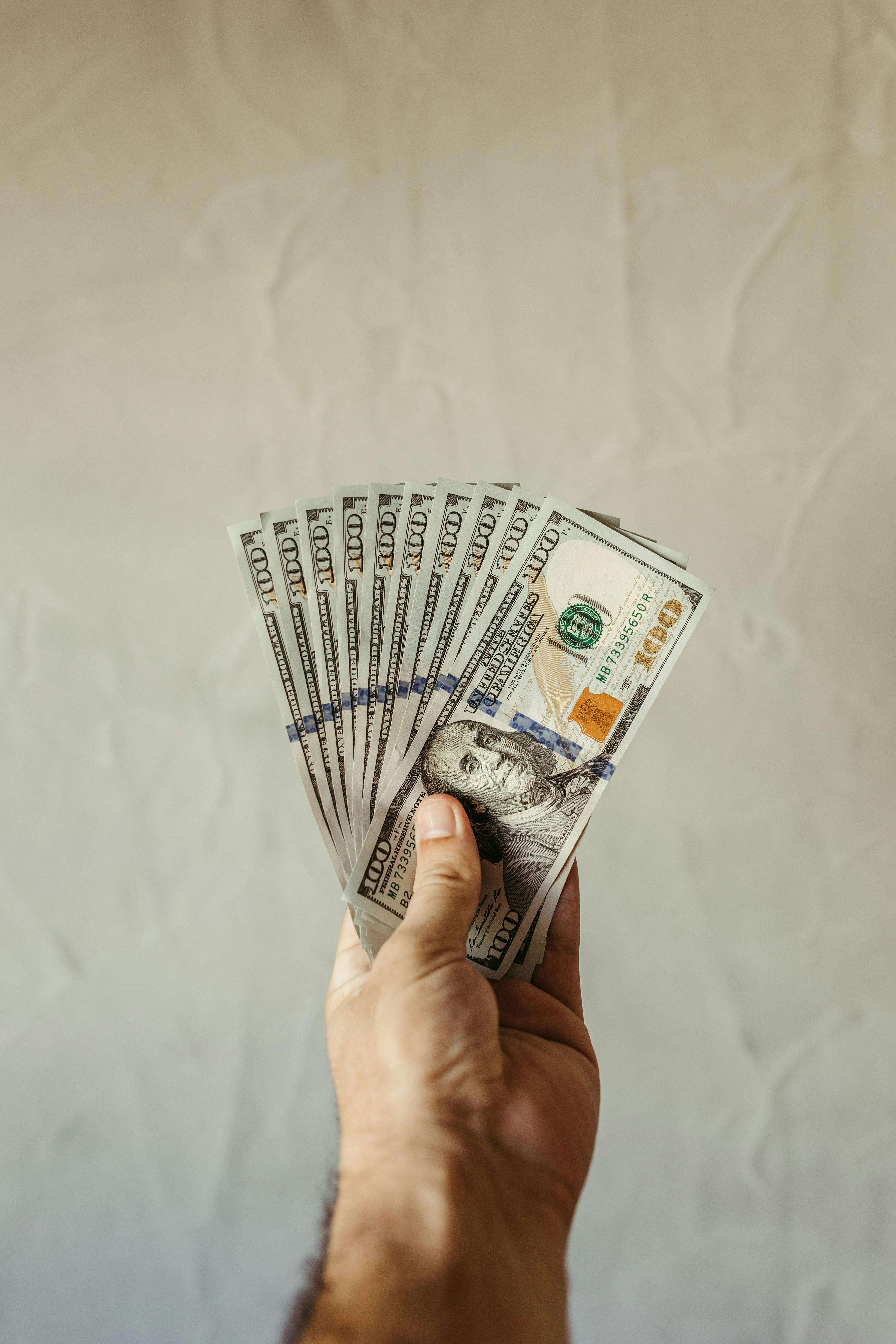 Woman Holding a Lot of Cash · Free Stock Photo