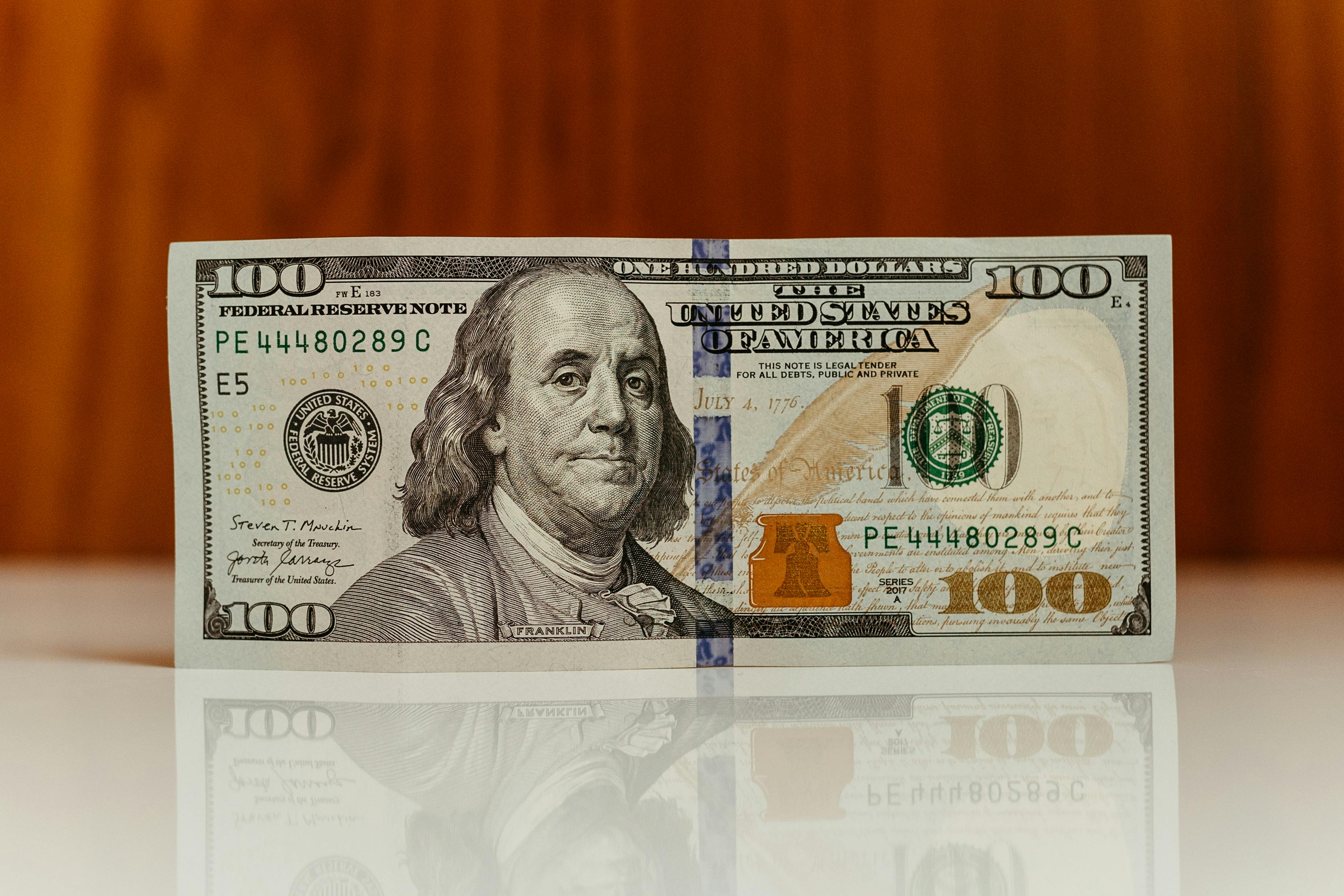 A Coin on Cash Notes · Free Stock Photo