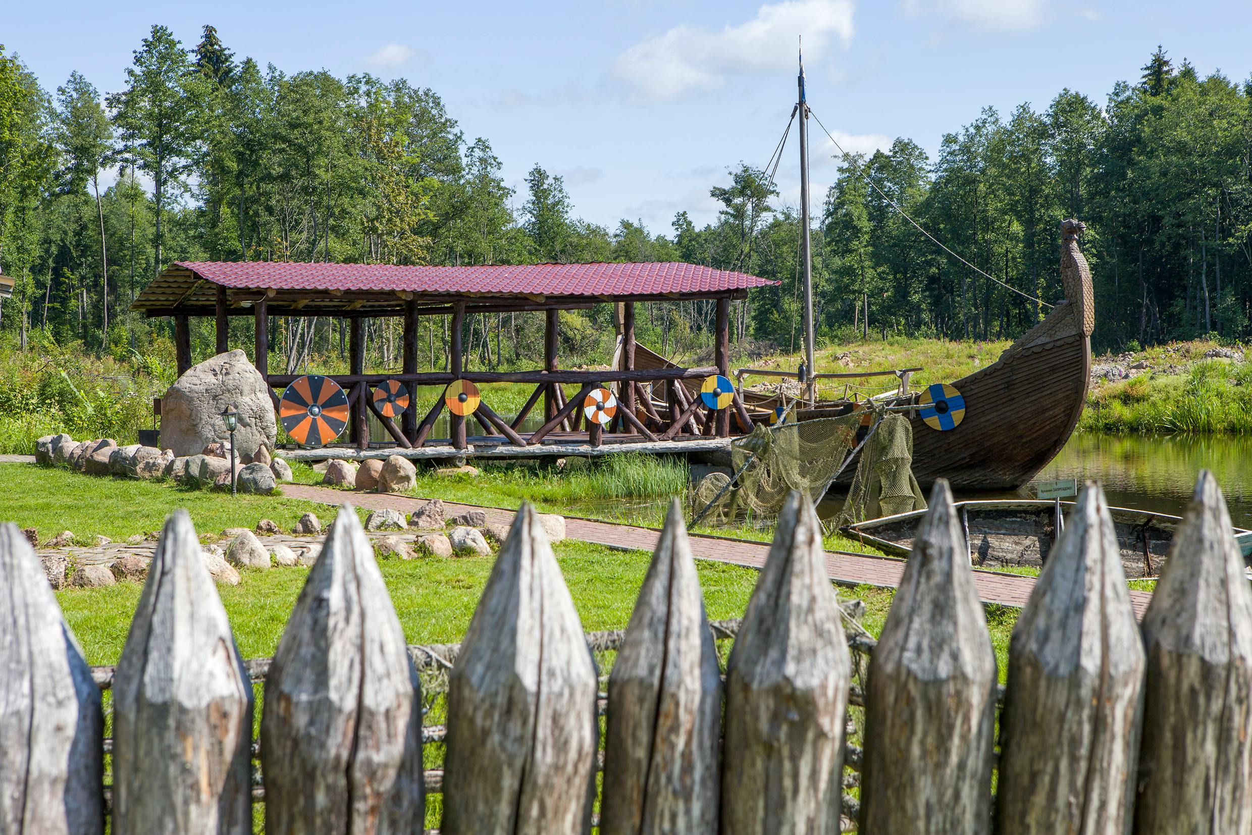 Reconstruction of a Medieval Boat at the Pier Decorated with Shields ...