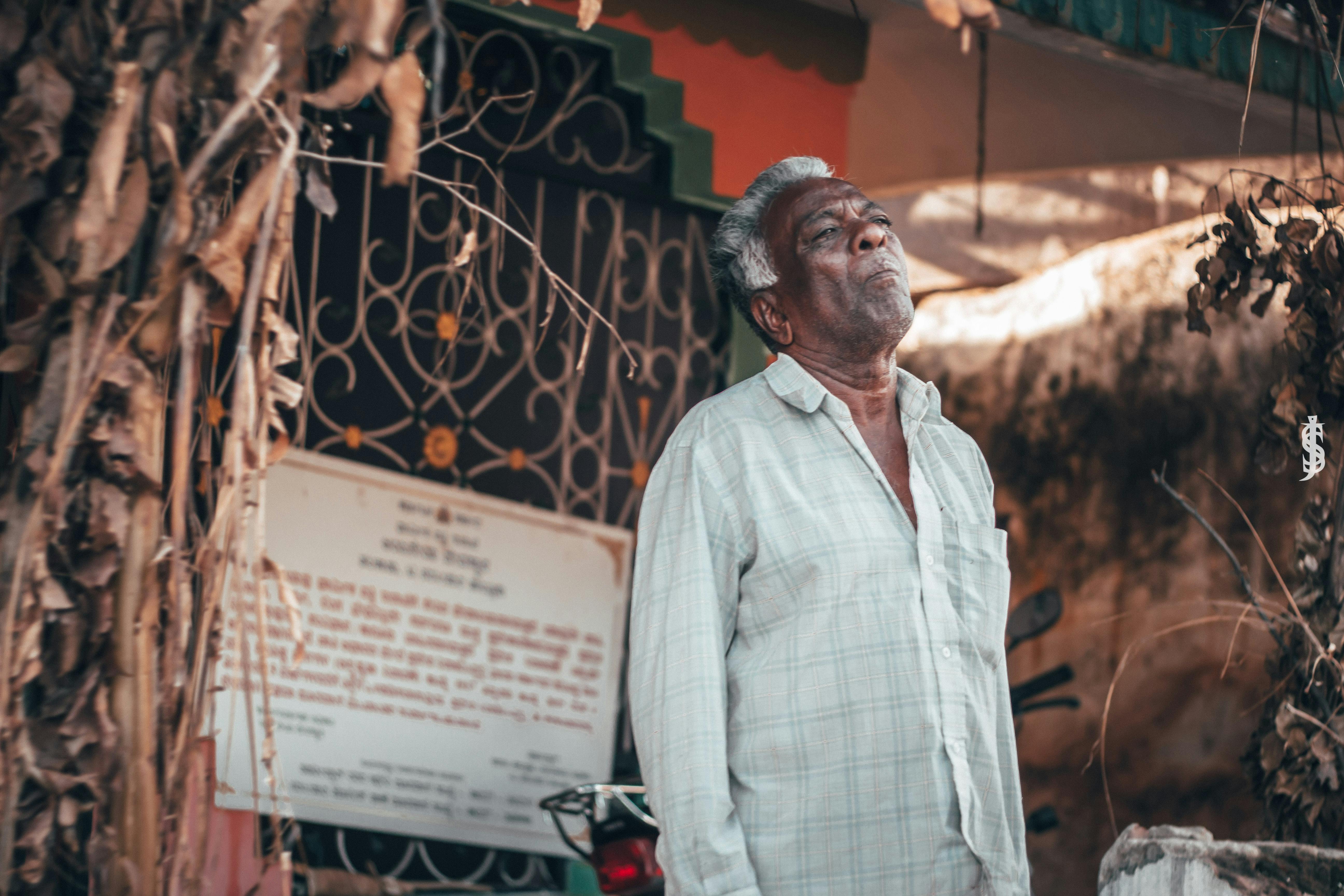 Man Standing Beside Tree · Free Stock Photo