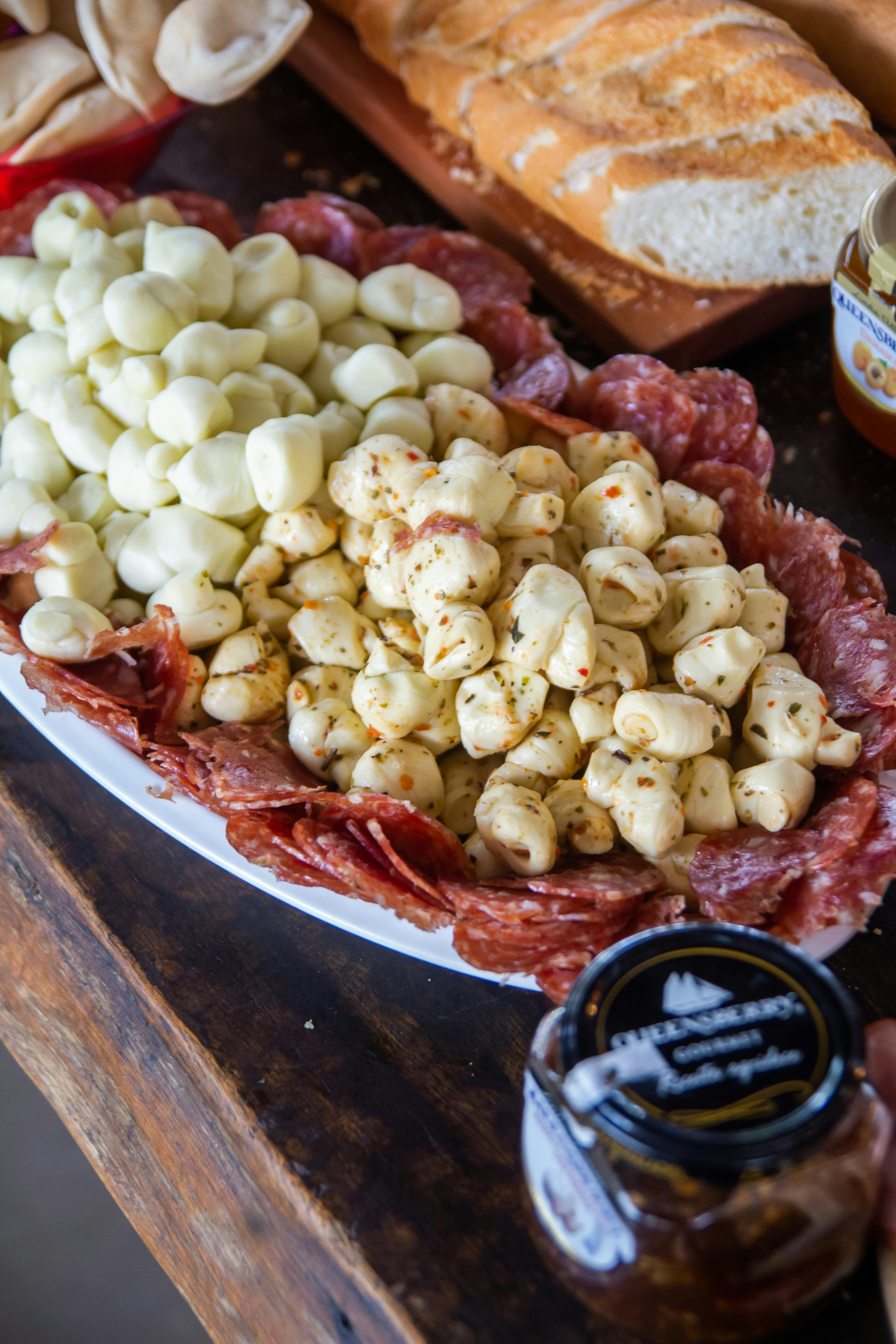 Hand Picking Ham from Tray · Free Stock Photo