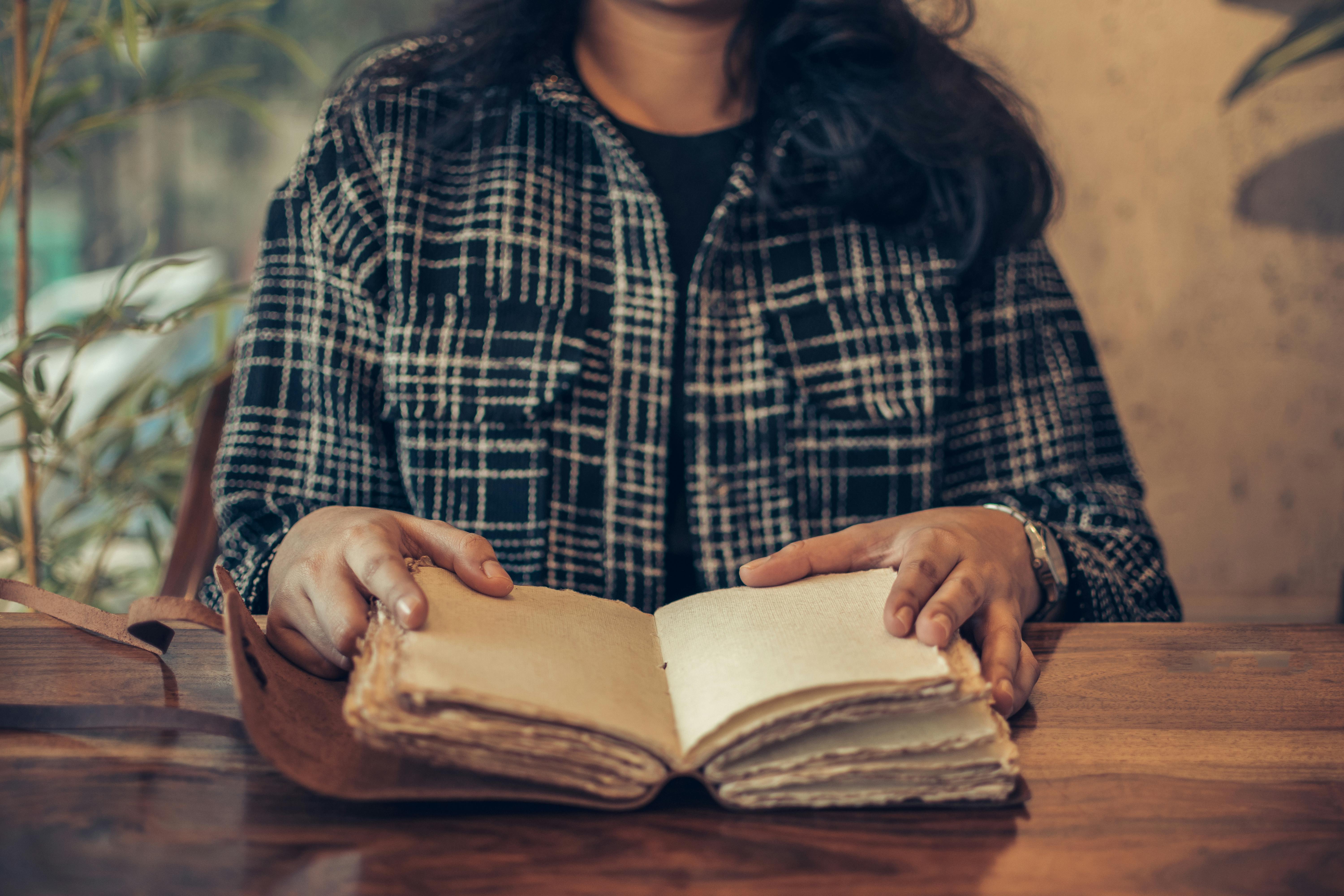 A Person Holding an Old Book · Free Stock Photo