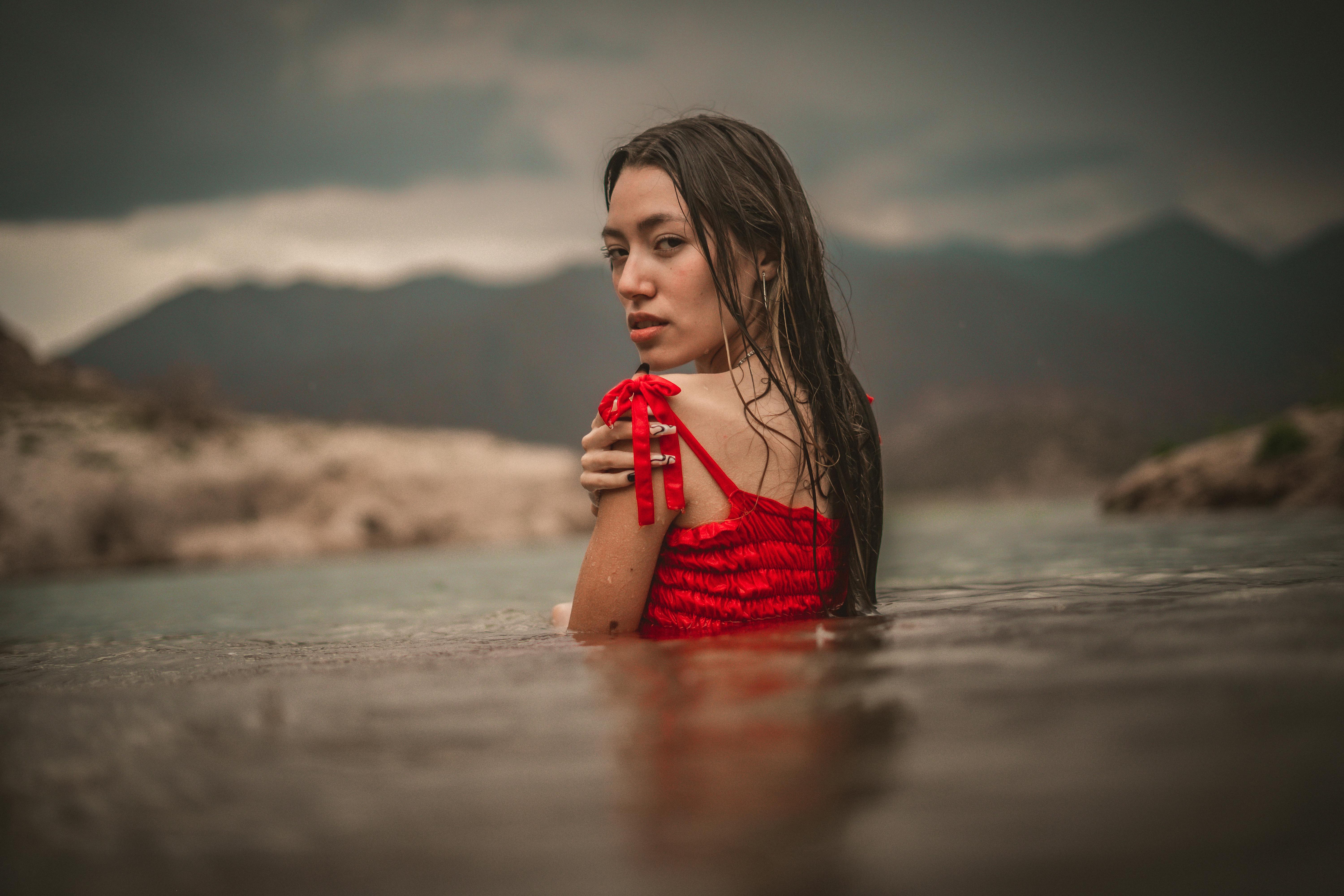A Woman in Bikini Swimming at the Beach · Free Stock Photo