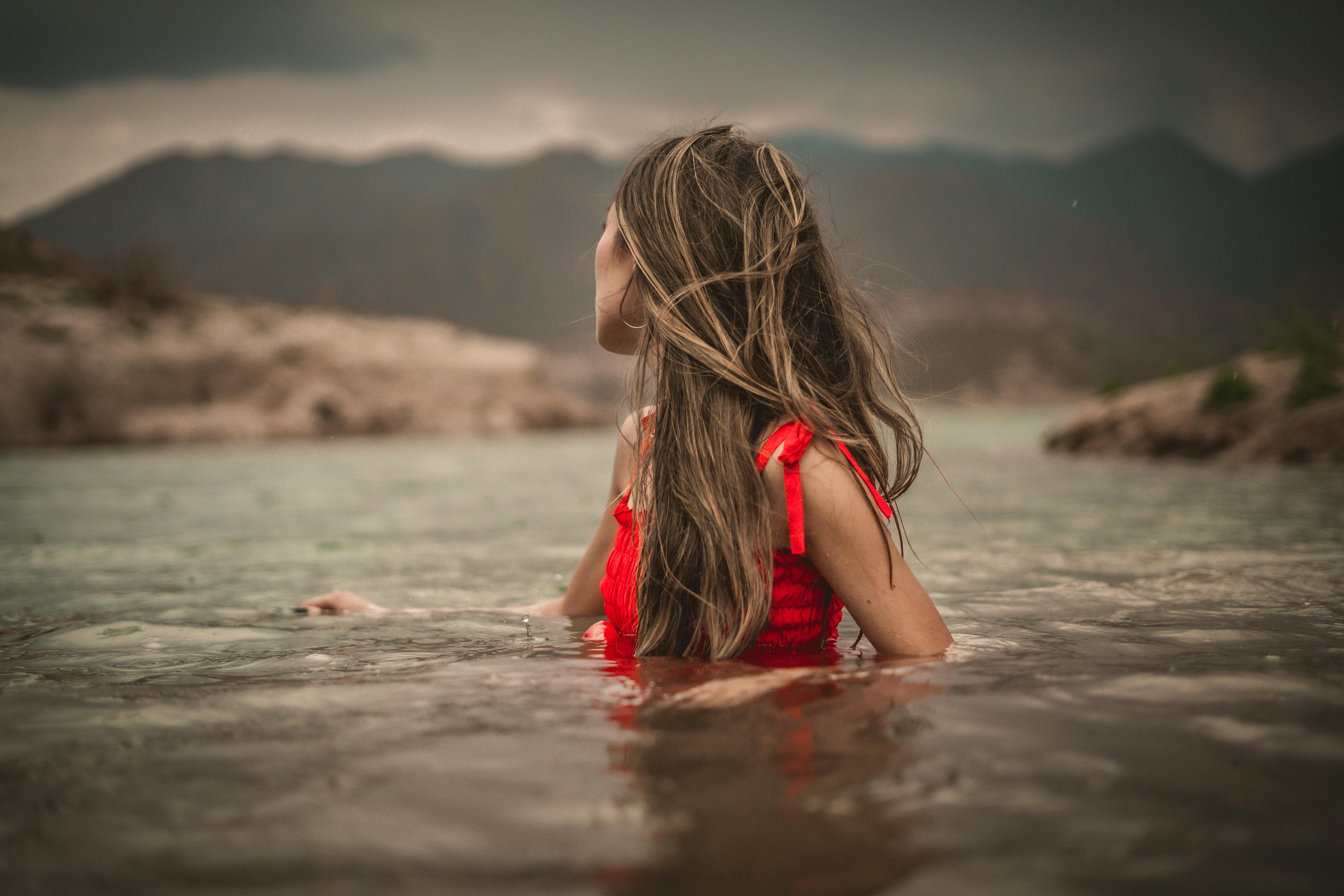 Woman Wearing Red Dress in Water · Free Stock Photo