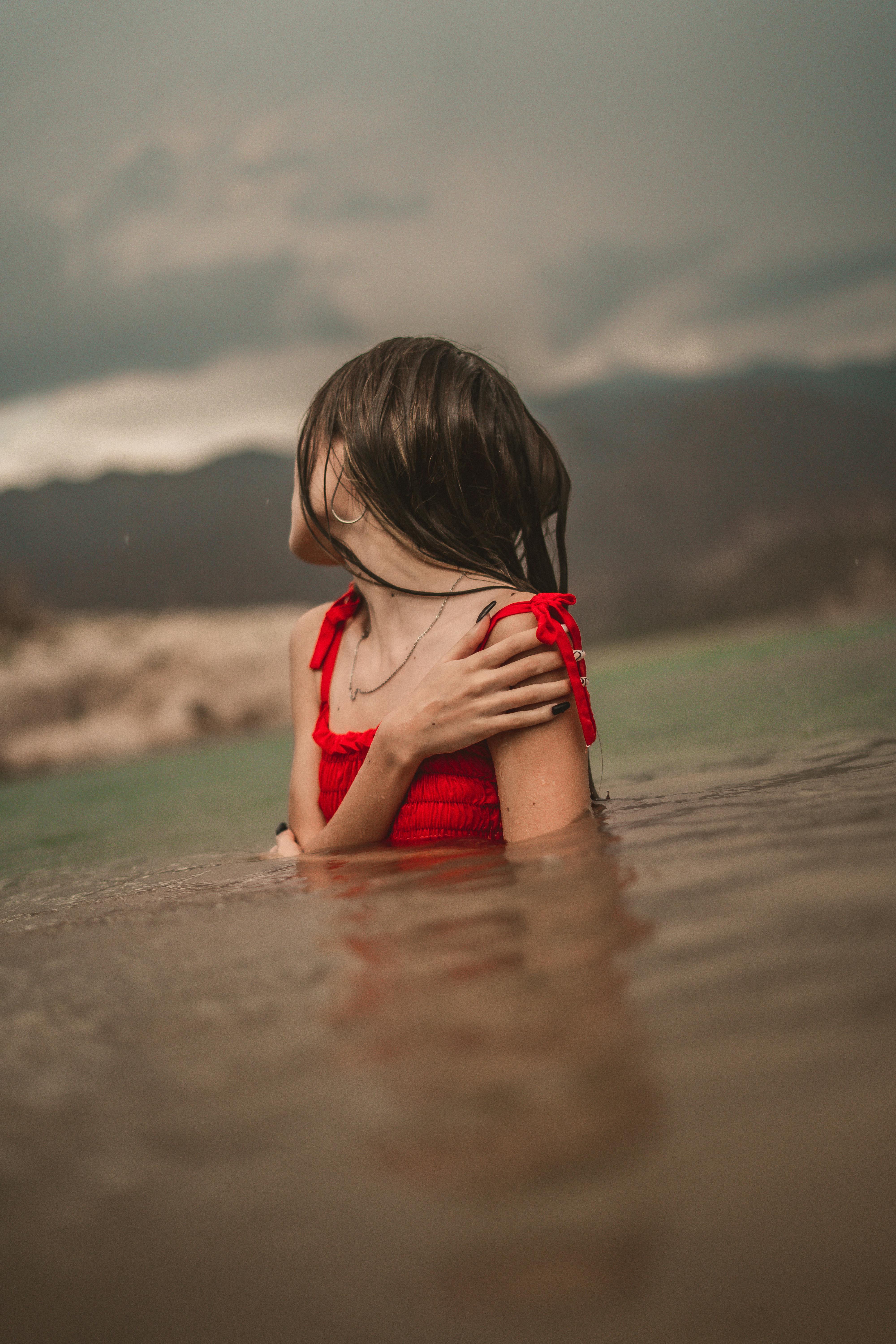 Young Woman in a Red Swimming Costume in the Water · Free Stock Photo