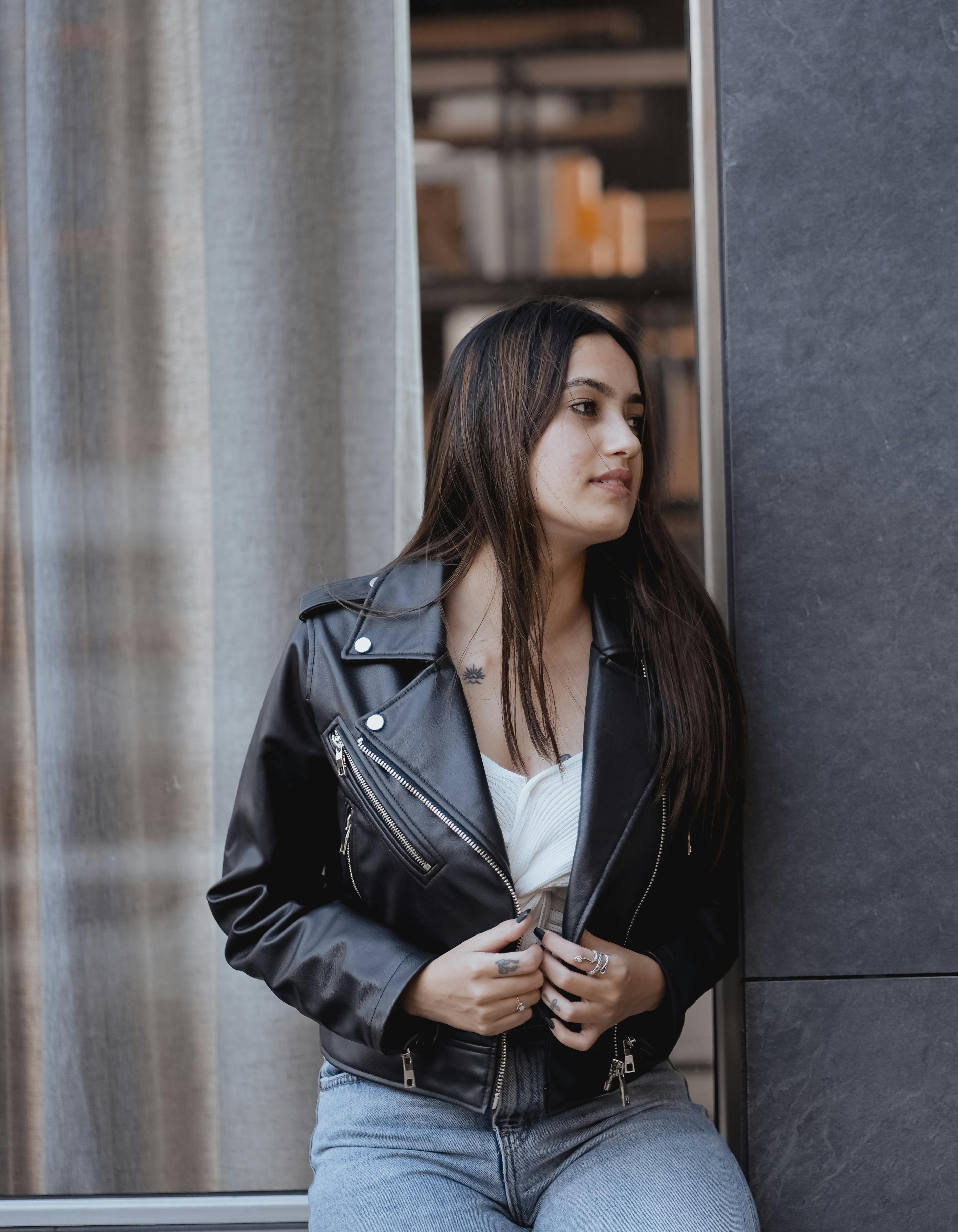 Woman Sitting on a Railing · Free Stock Photo