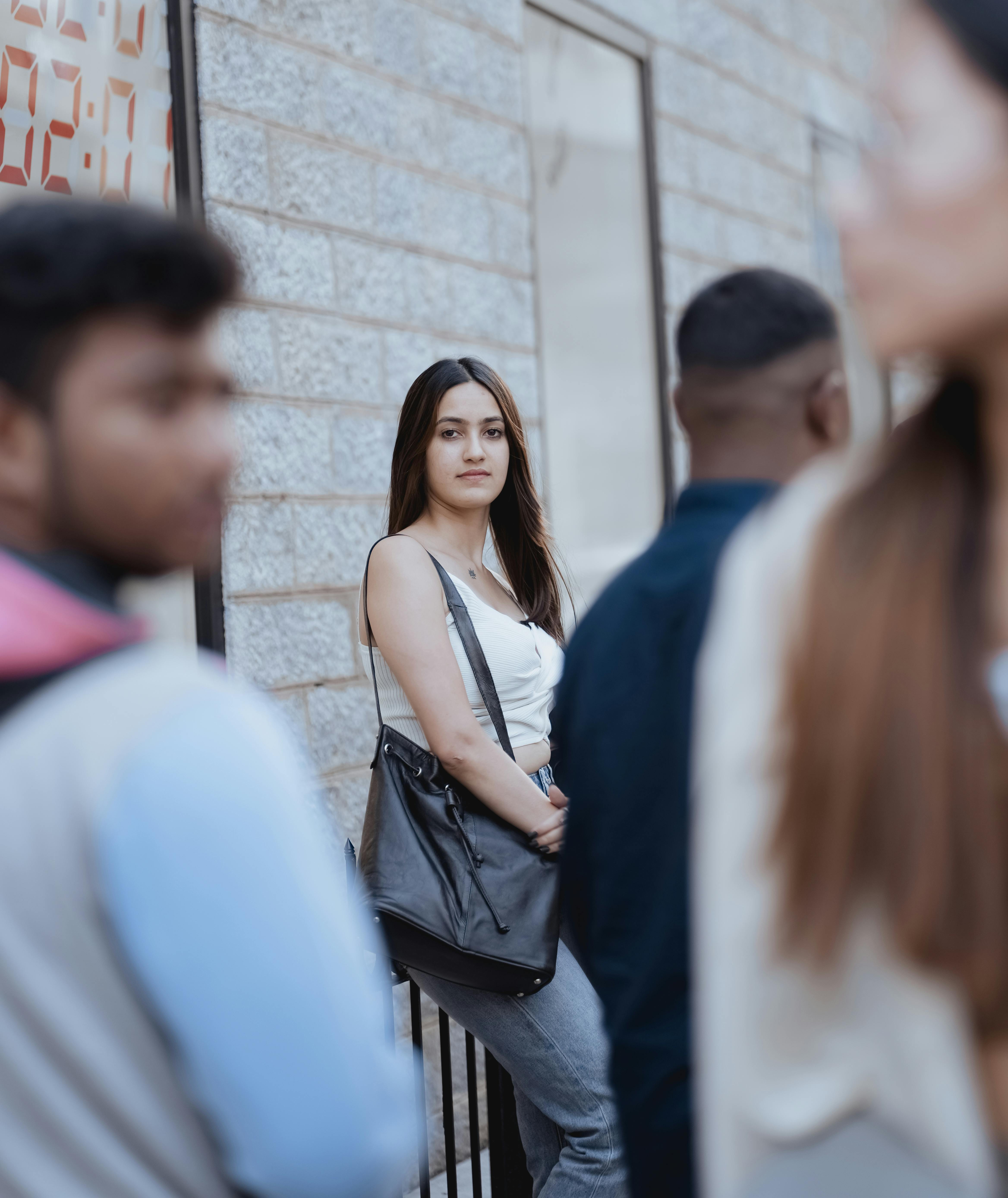 Woman Leaning on a Railing · Free Stock Photo
