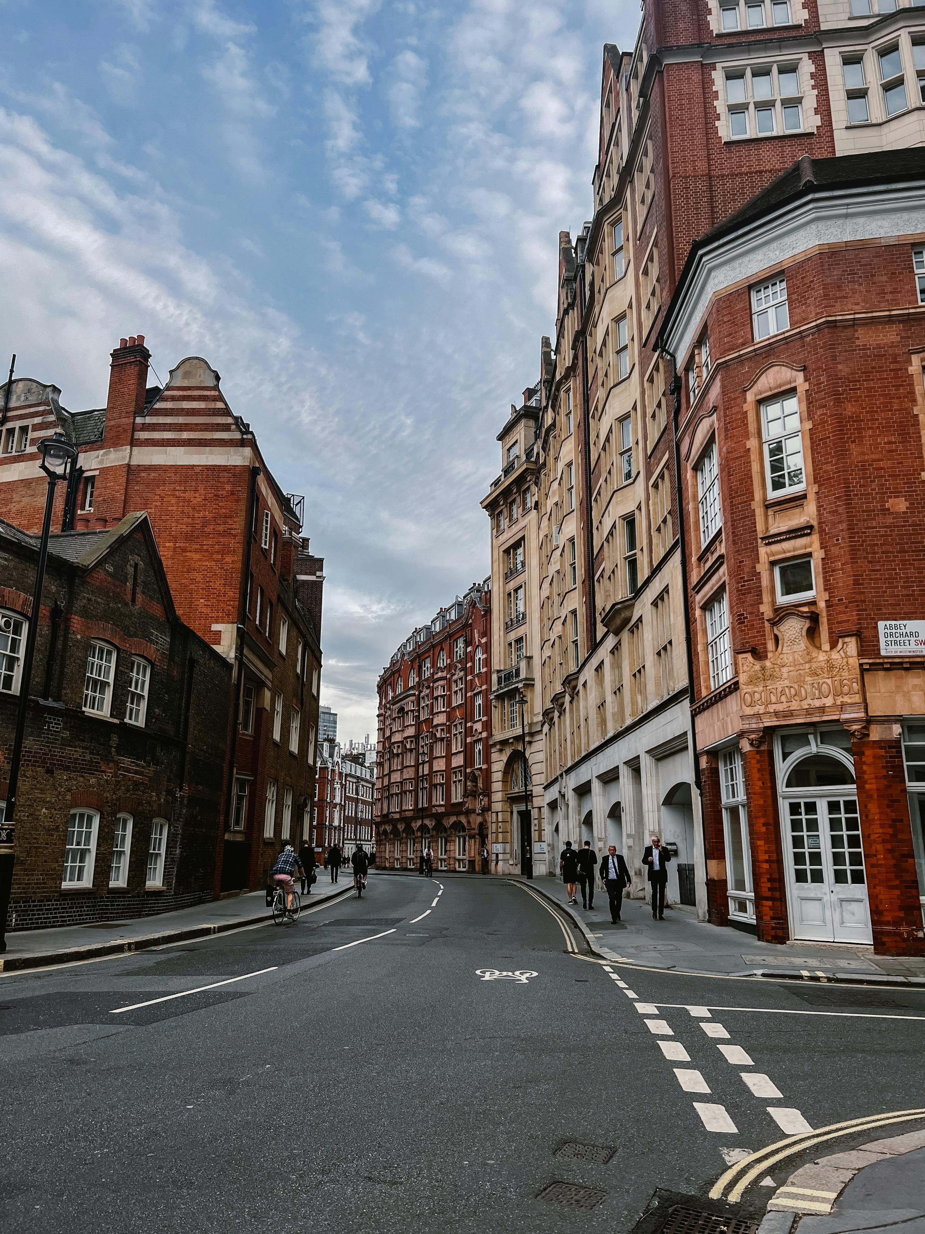 A Road in Between Concrete Buildings · Free Stock Photo