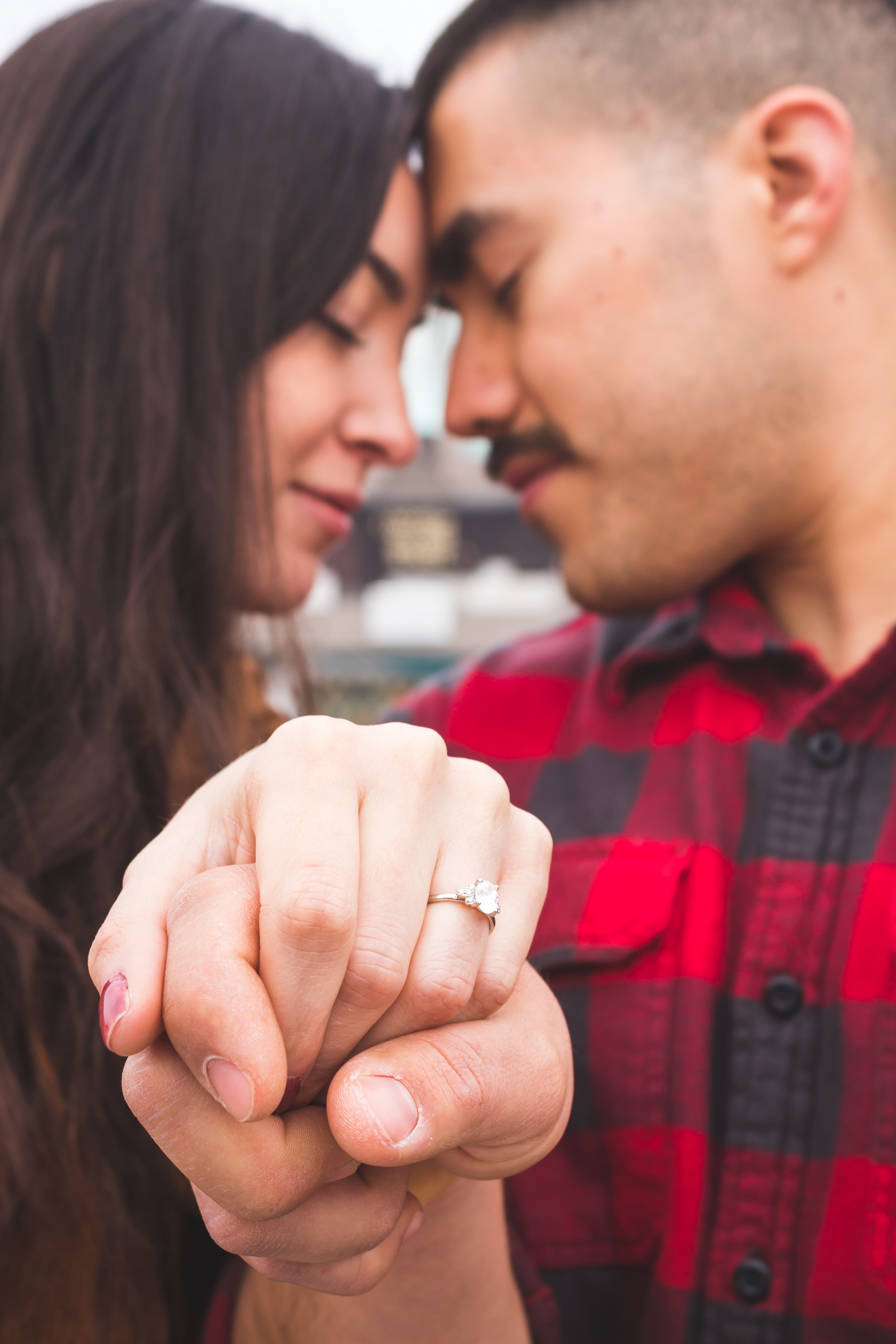 Close-up of Young Couple Holding Hands · Free Stock Photo