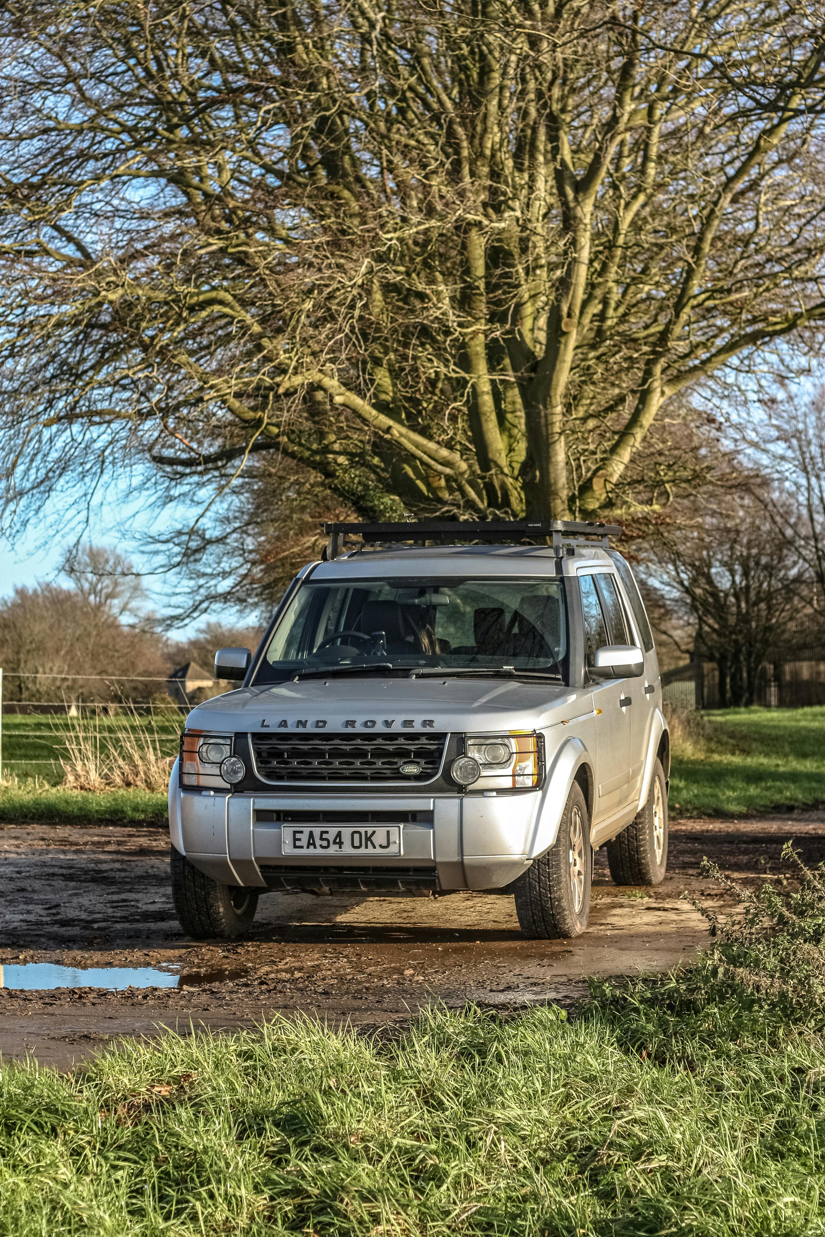 Land Rover SUV Car on a Countryside Road · Free Stock Photo