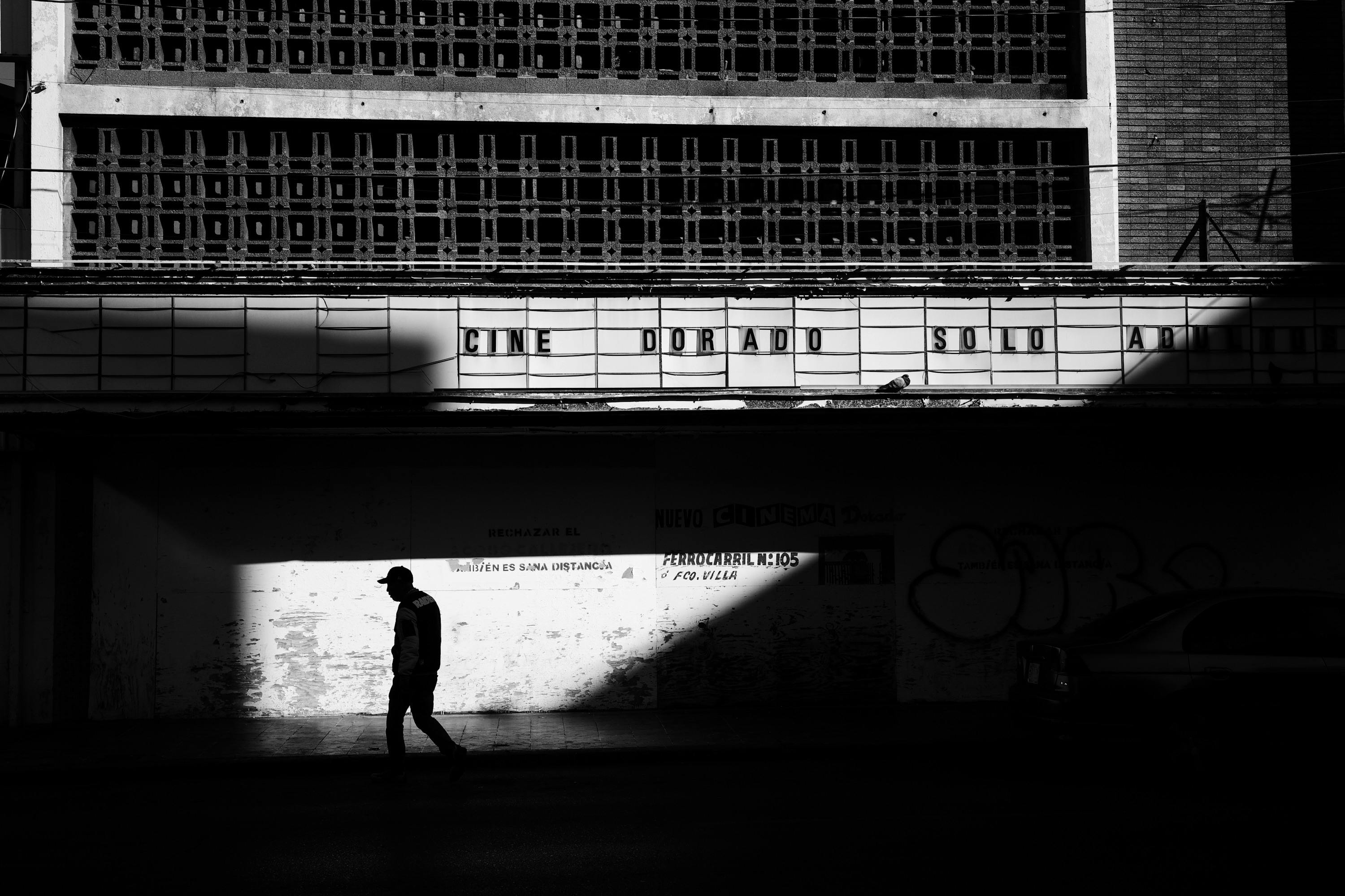 Man Walking in Shadow in Town · Free Stock Photo