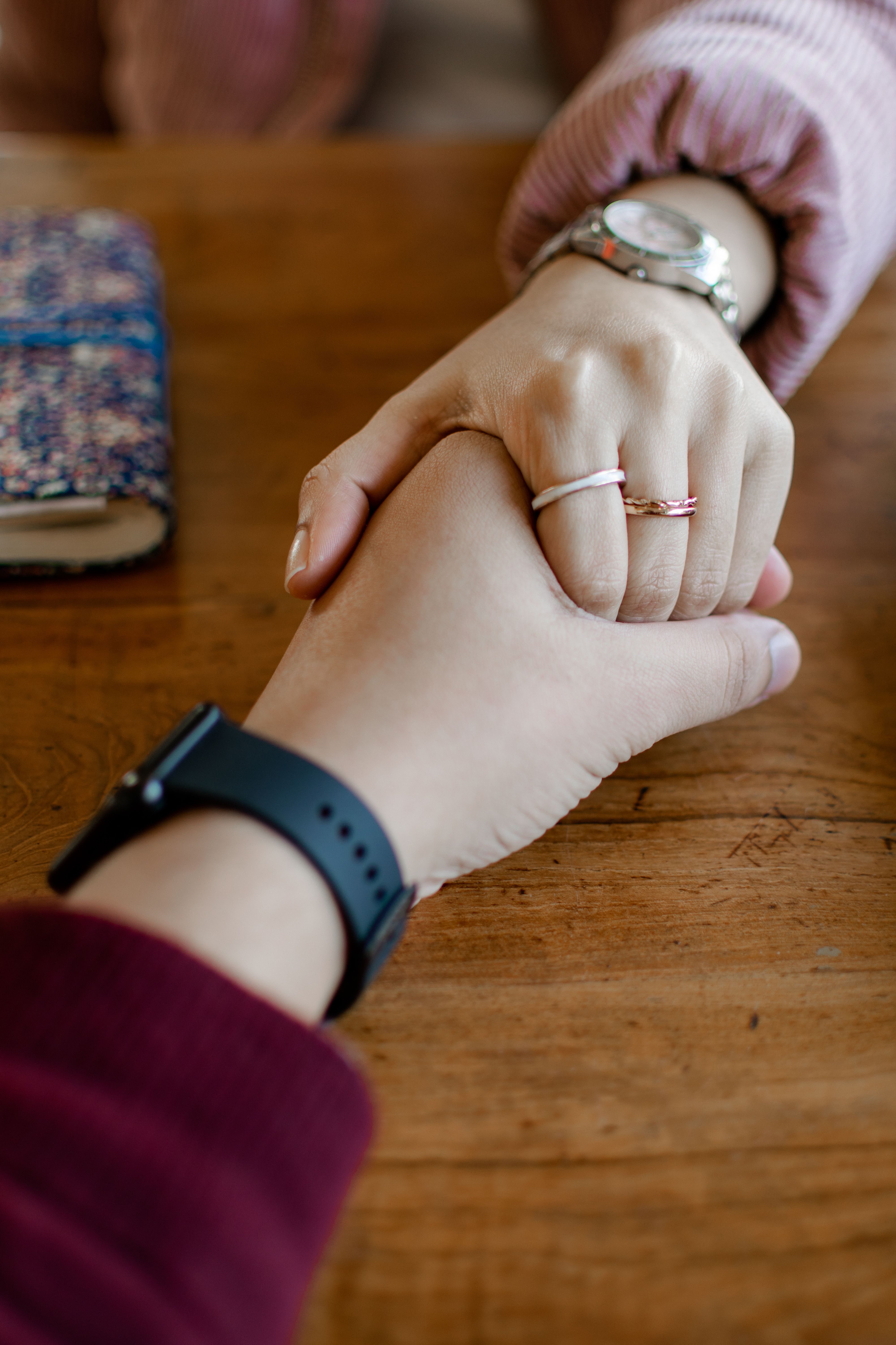 Close Up Shot of a Holding Hands · Free Stock Photo