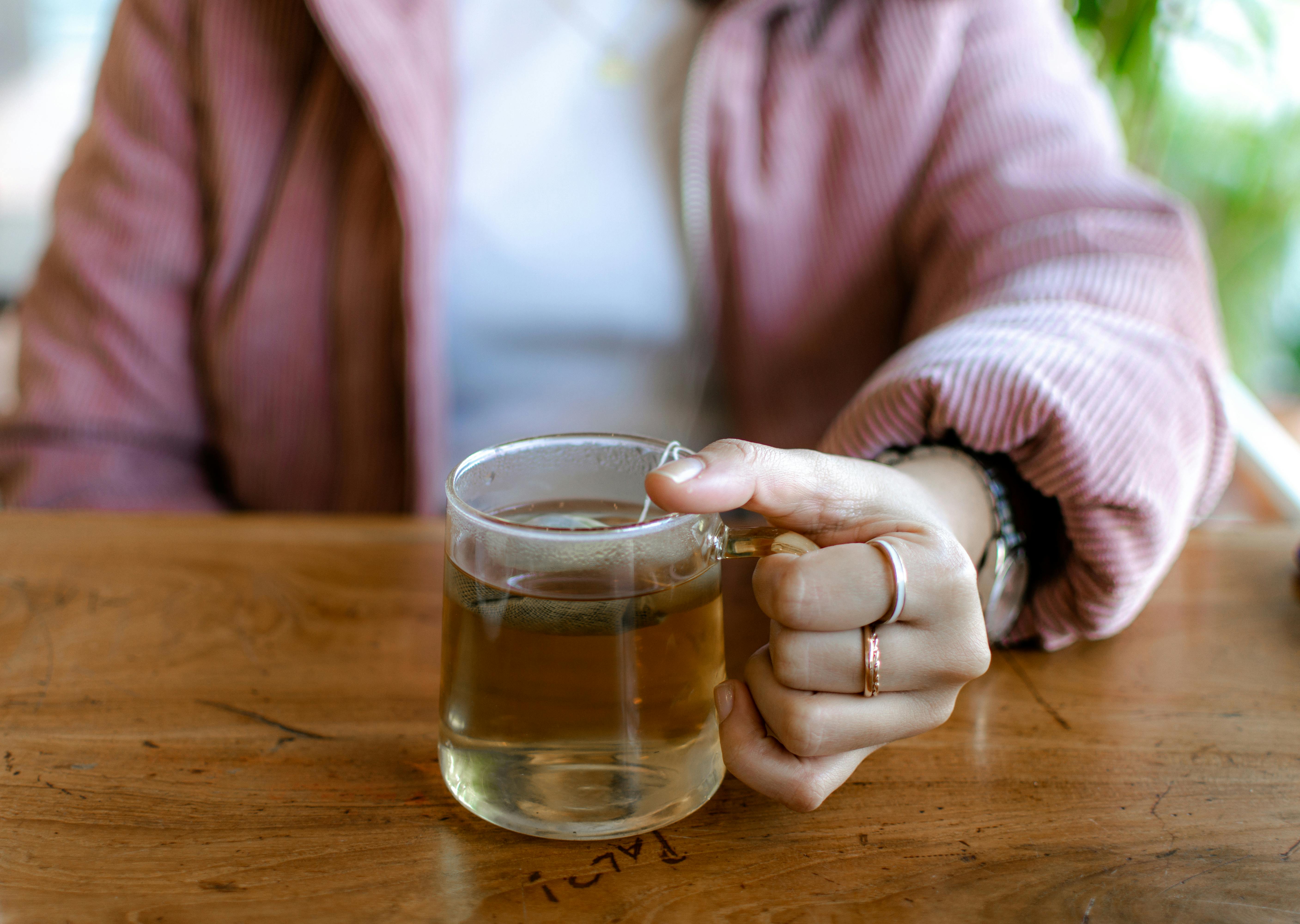 A Person Holding a Cup of Tea · Free Stock Photo