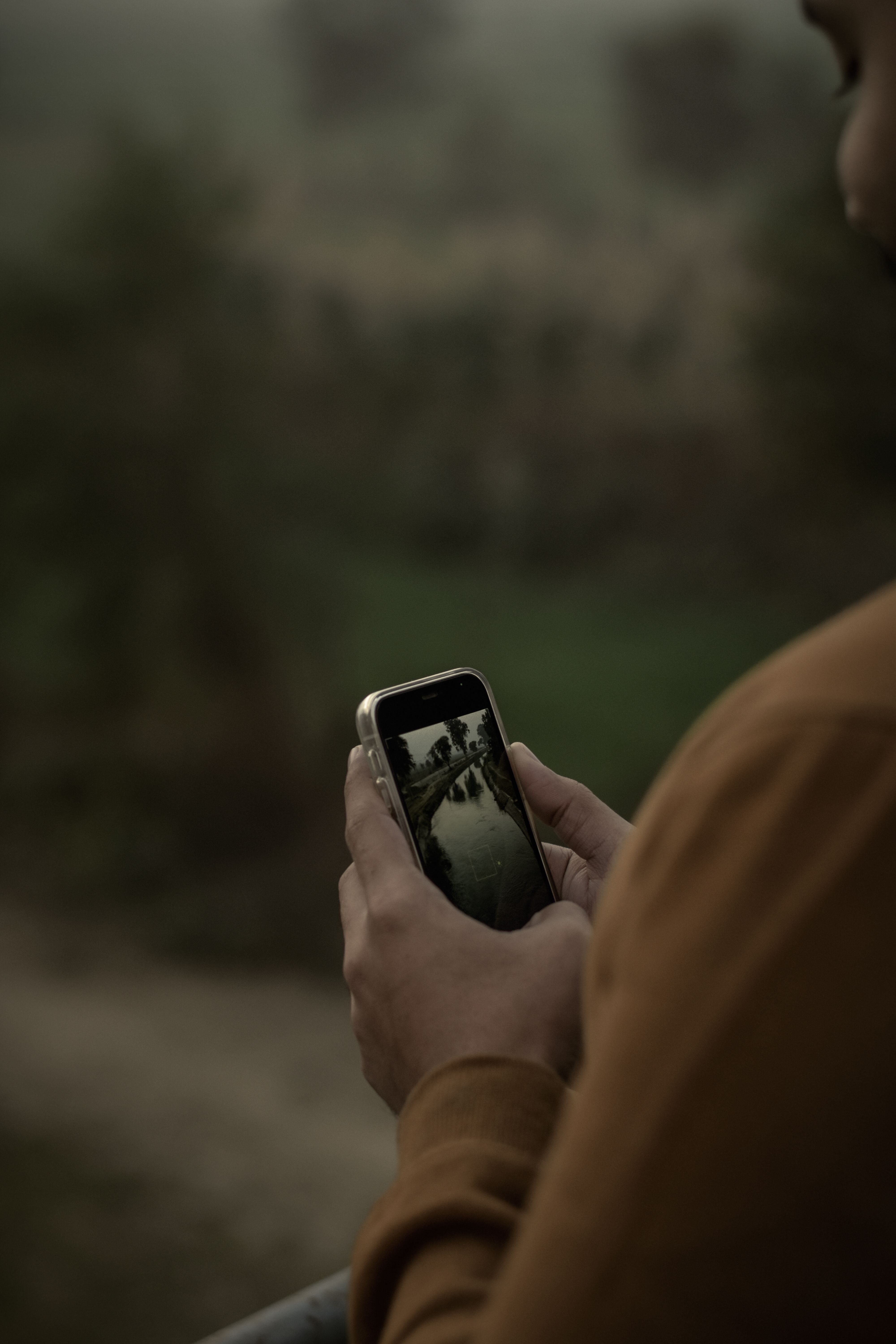 Person Using a Spotify on His Smartphone · Free Stock Photo