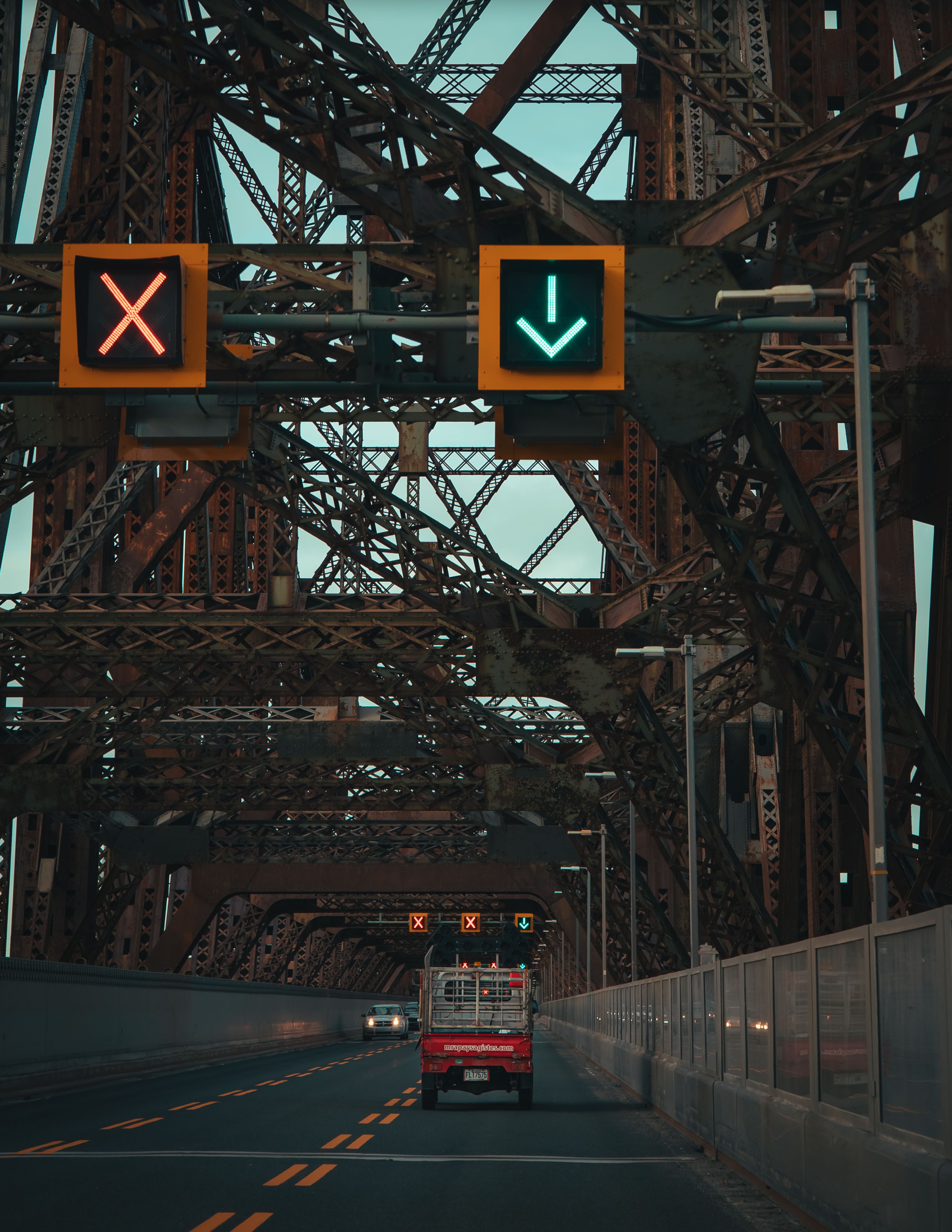 Signs above Road Lanes on Iron Bridge · Free Stock Photo