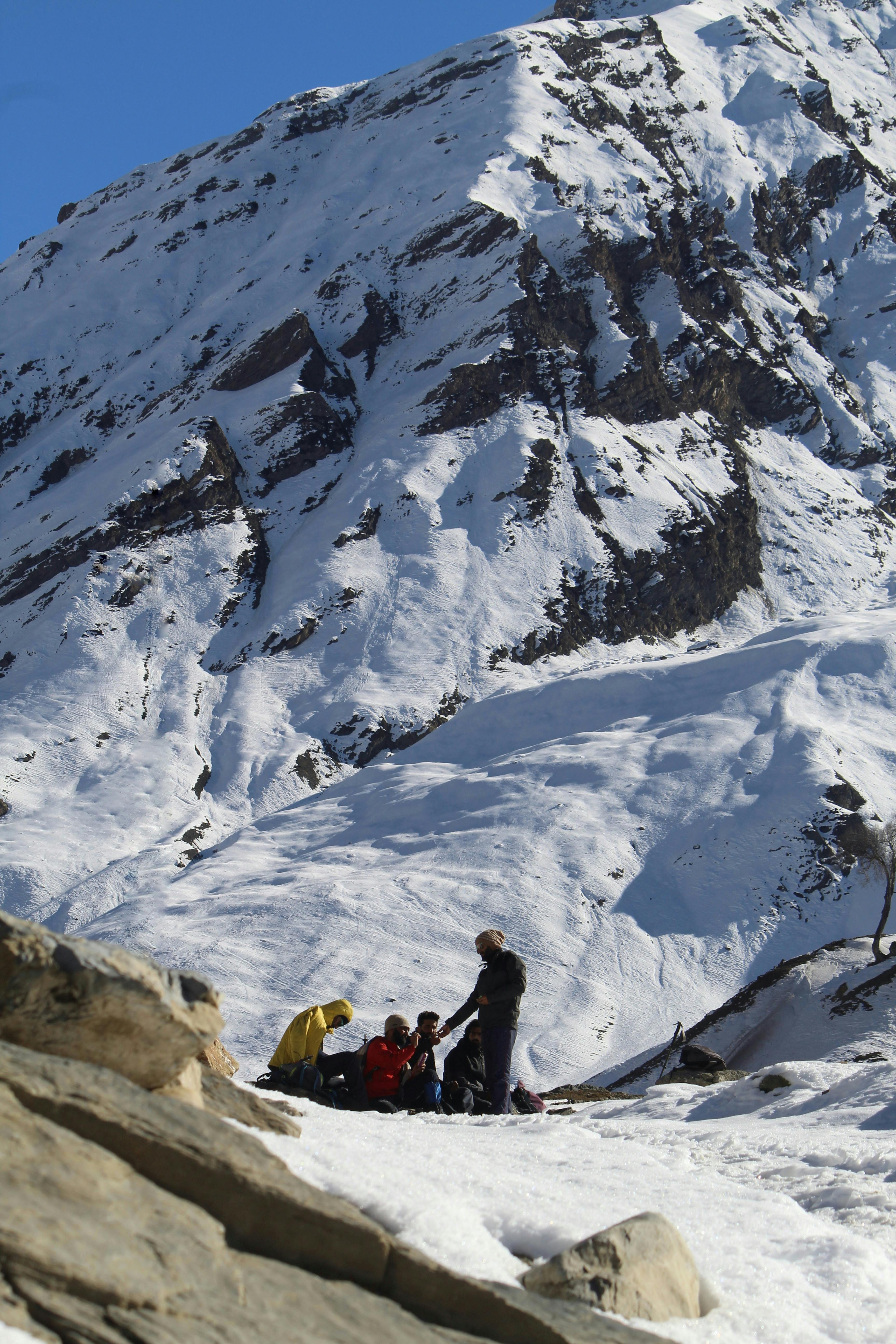 Hikers Resting in Snowy Mountains · Free Stock Photo