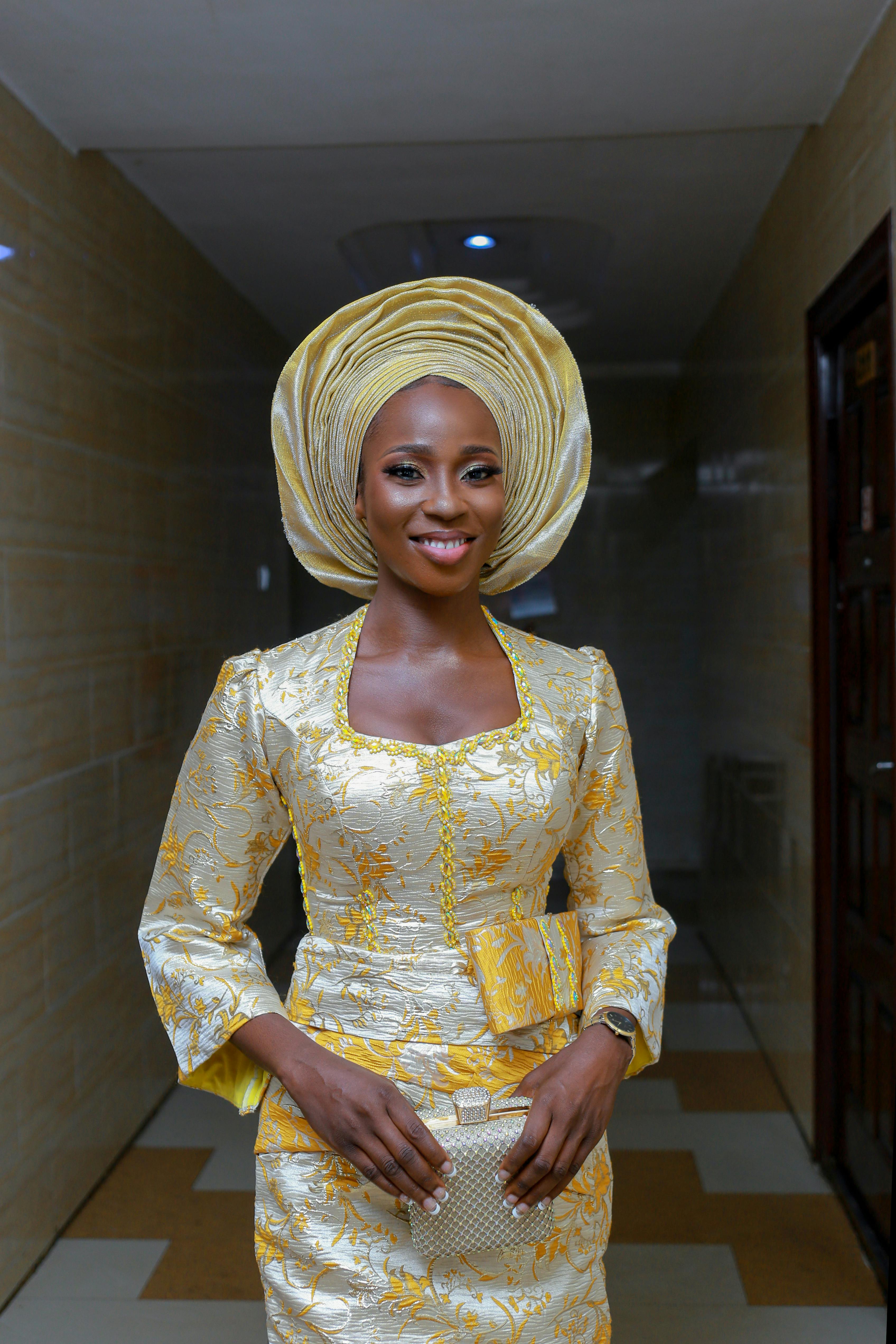 Photo of a Woman in Traditional Wear Smiling · Free Stock Photo